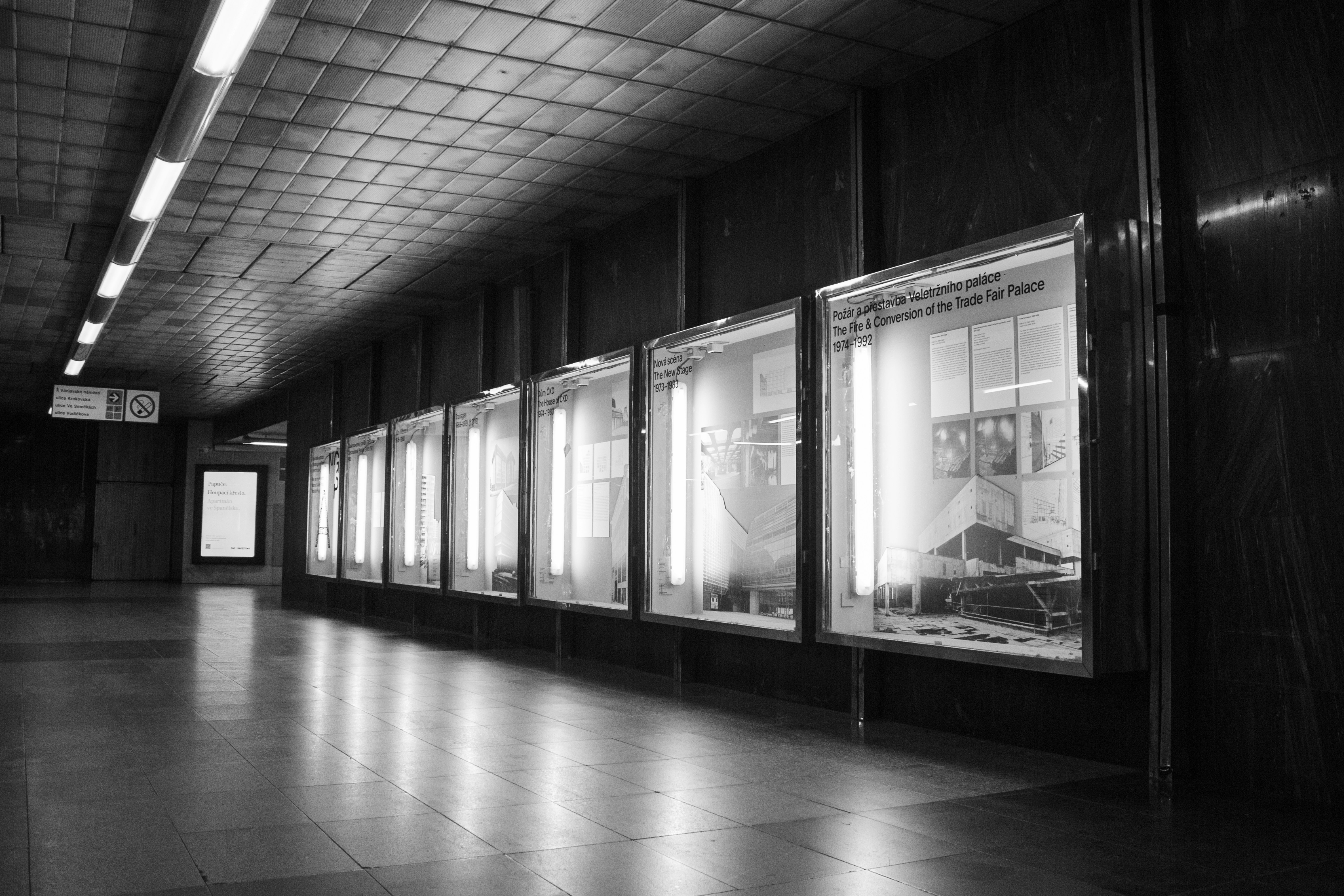 Coffe break from my work? :) https://buymeacoffee.com/davidlembas | Row of illuminated billboards in a dark subway station.