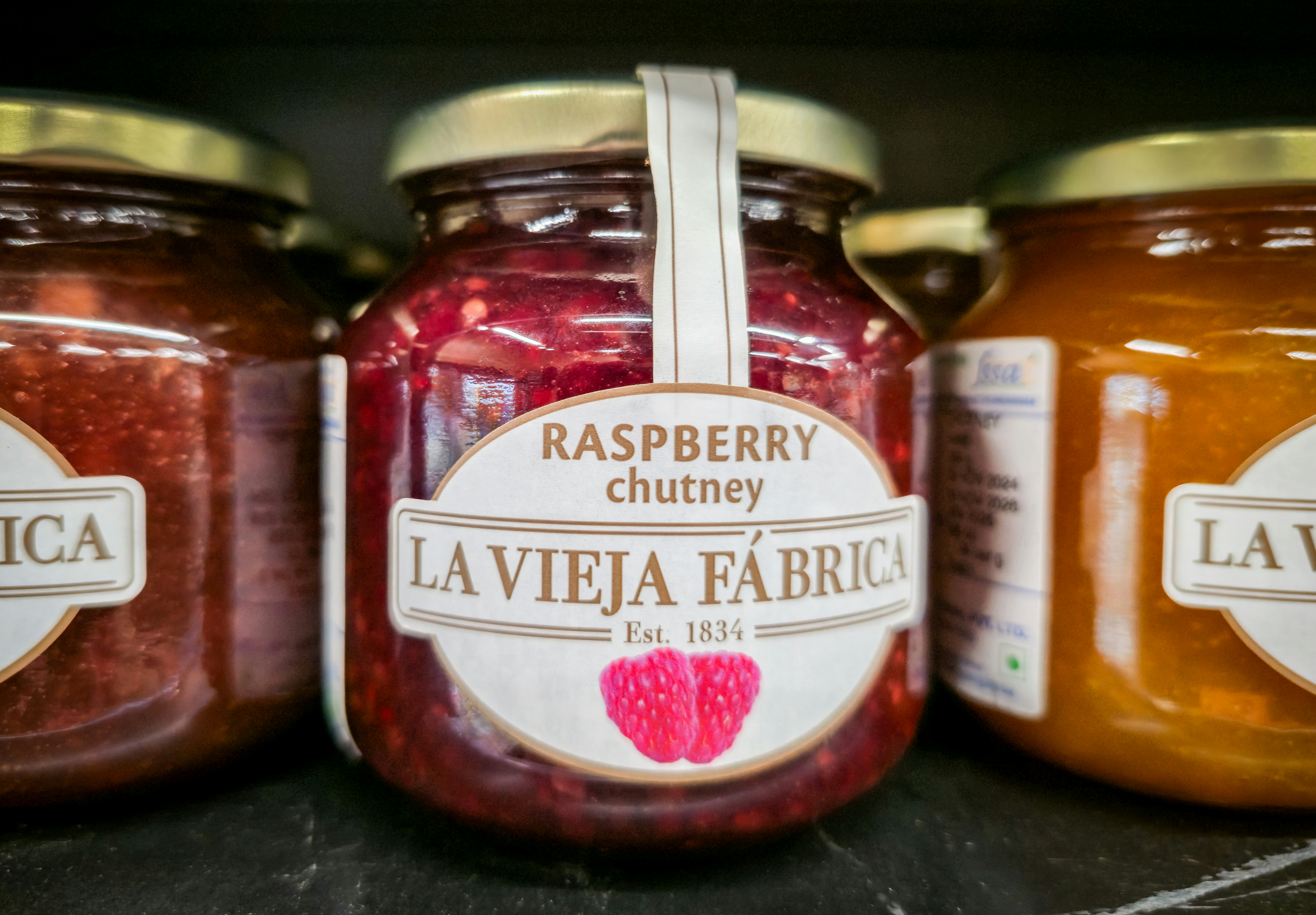 Centered Raspberry Jam Label: Rustic Pantry Close-Up