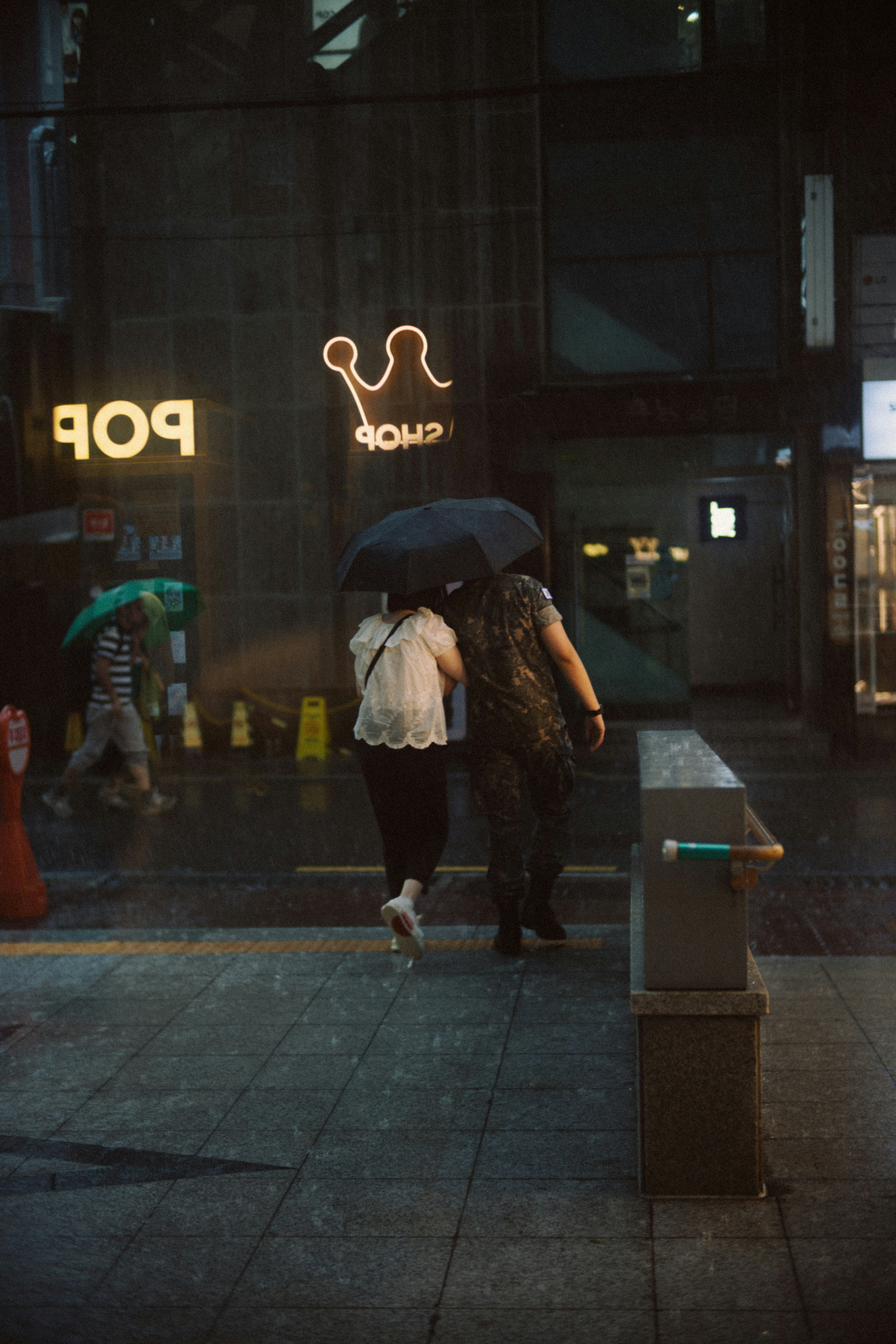 Embrace in the Rain: A Moment of Connection