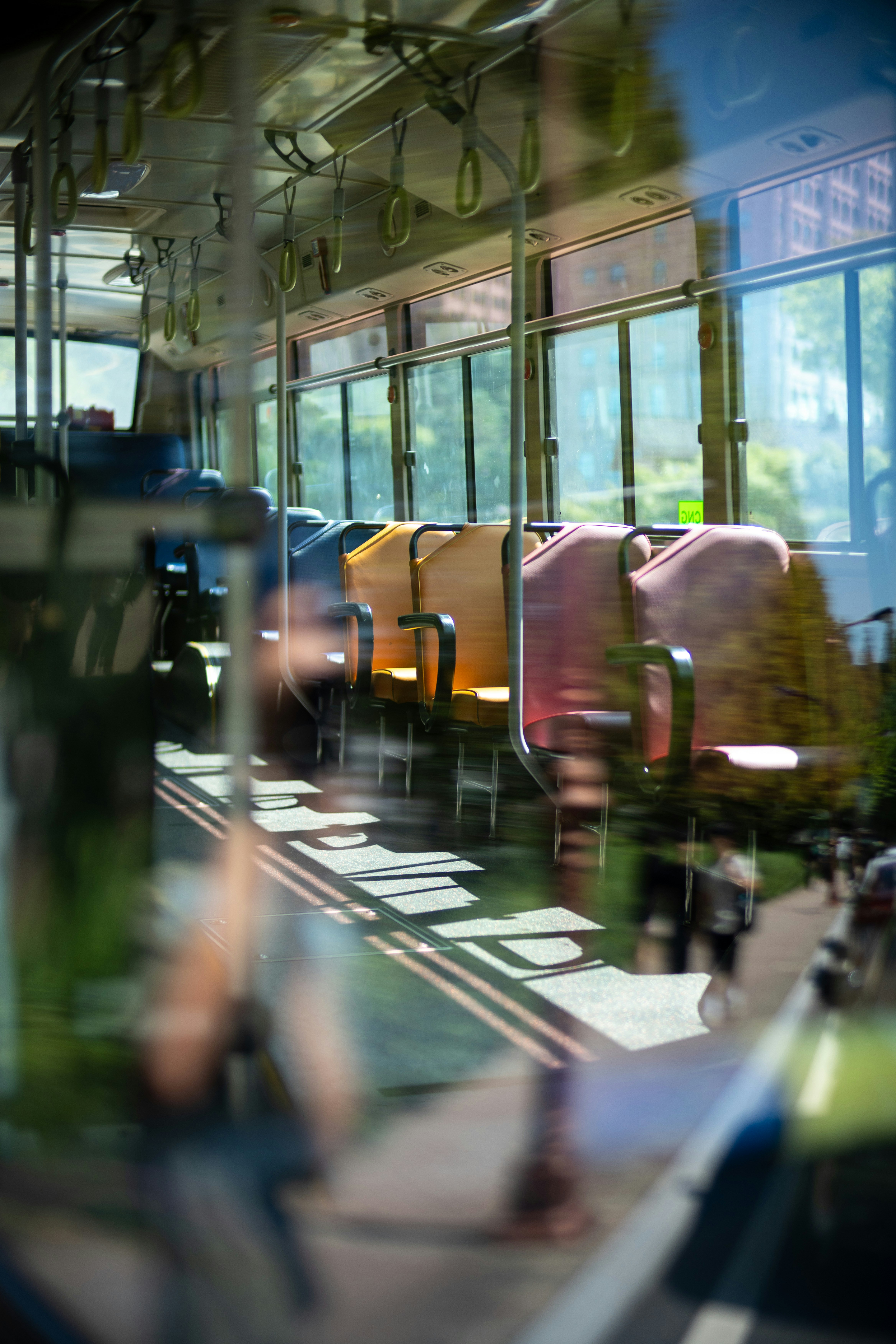 Bus Interior in Soft Focus: A Quiet Moment Through Glass