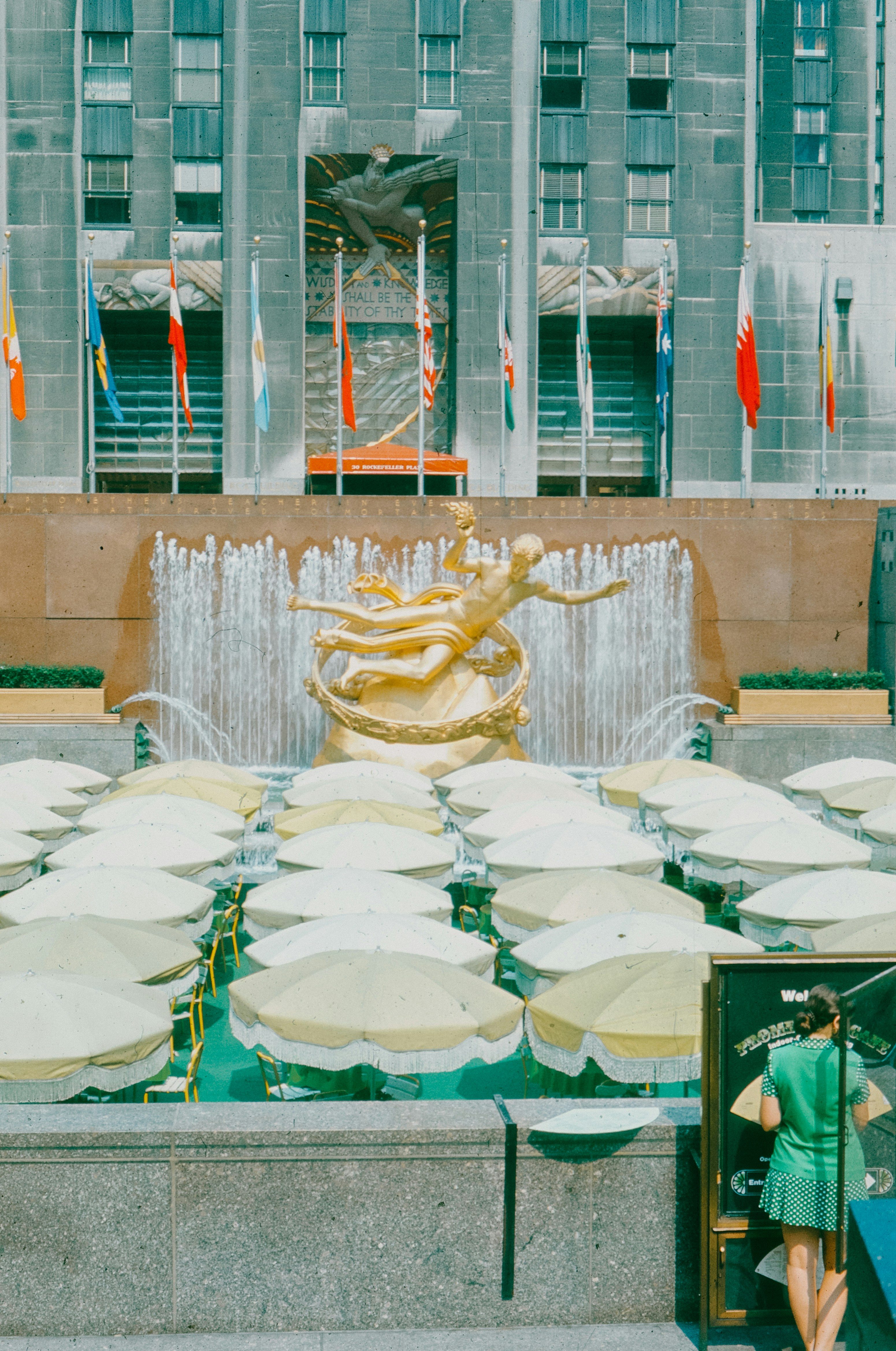 Golden prometheus statue with umbrellas and fountain photo – Free ...