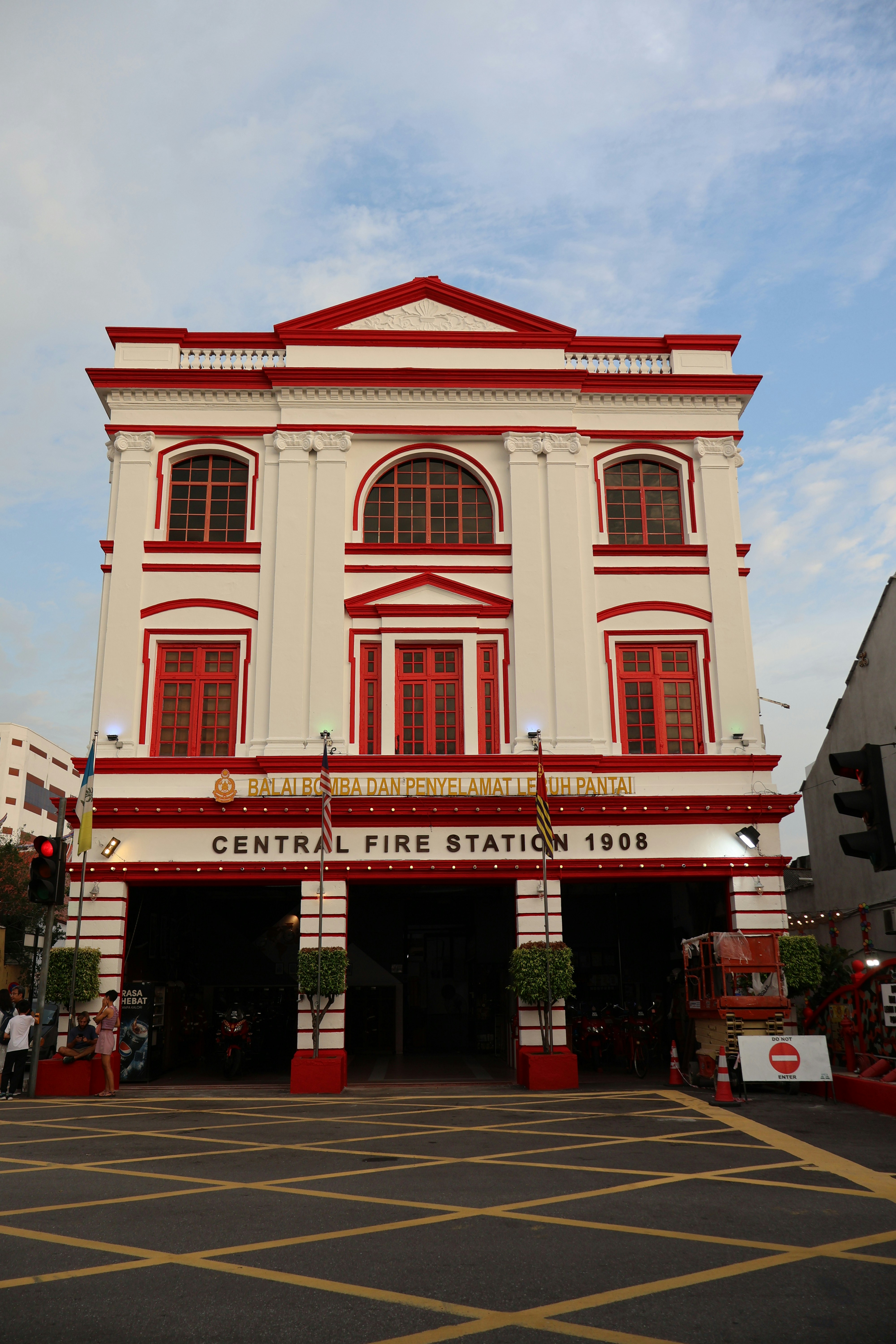 Central Fire Station 1908 (Front View) which Located at : Balai Bomba Dan Penyelamat, George Town, 10300 George Town, Pulau Pinang | Historic central fire station building with red accents.