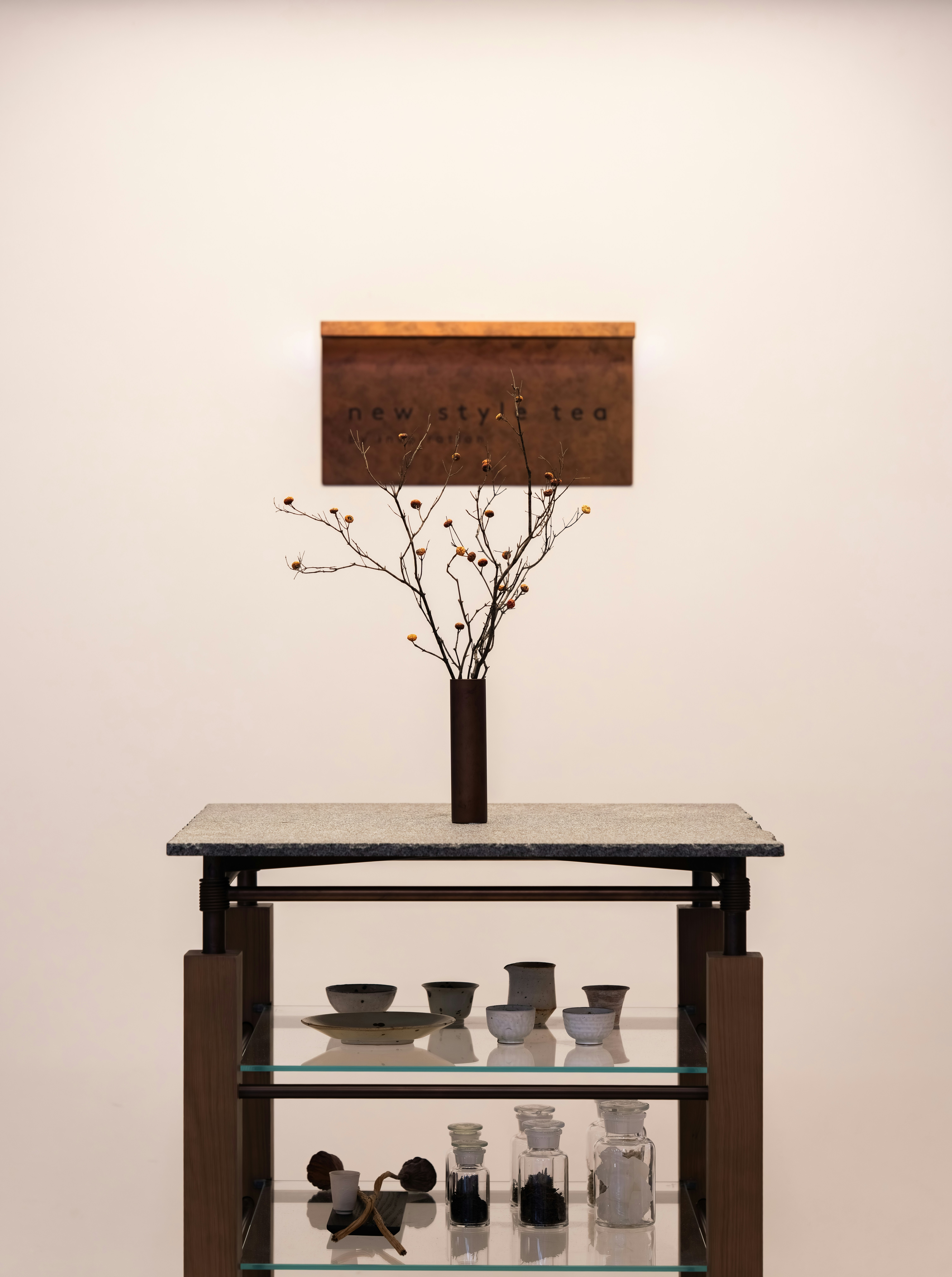 Decorative display with vases and pottery on shelves