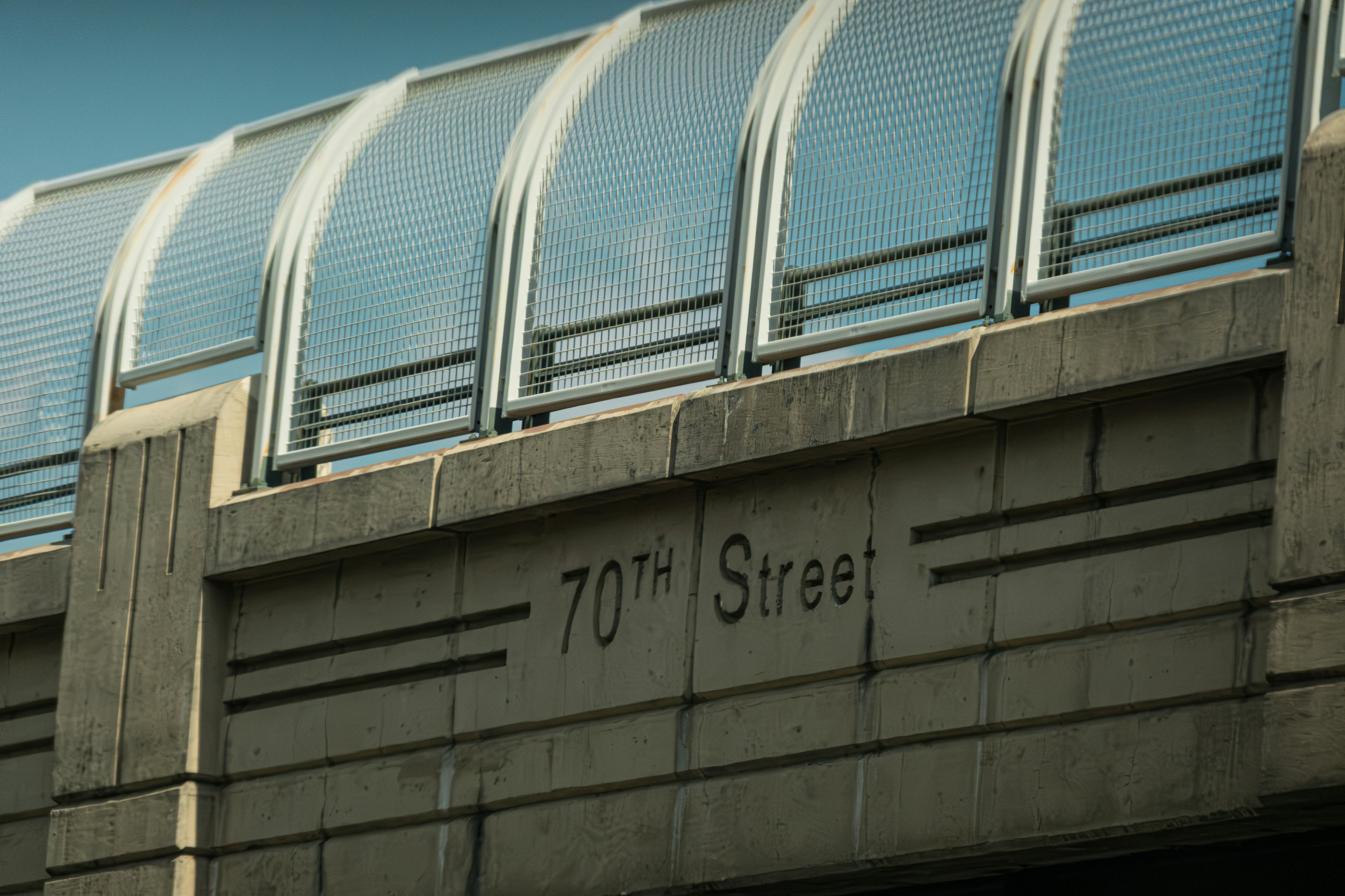 70th street sign on a concrete structure