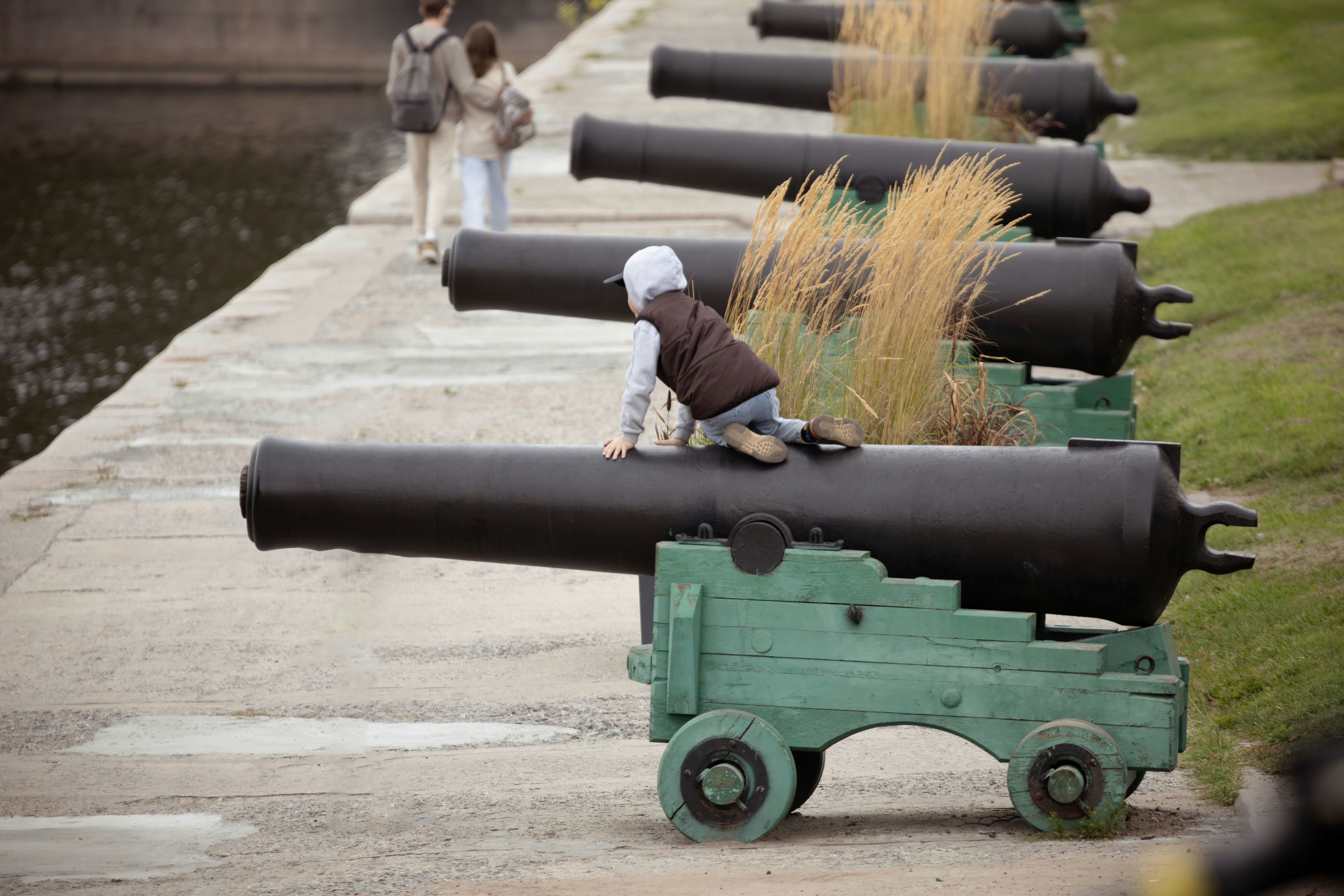 Line of Coastal Artillery: Children Explore Historic Cannons by the Pier