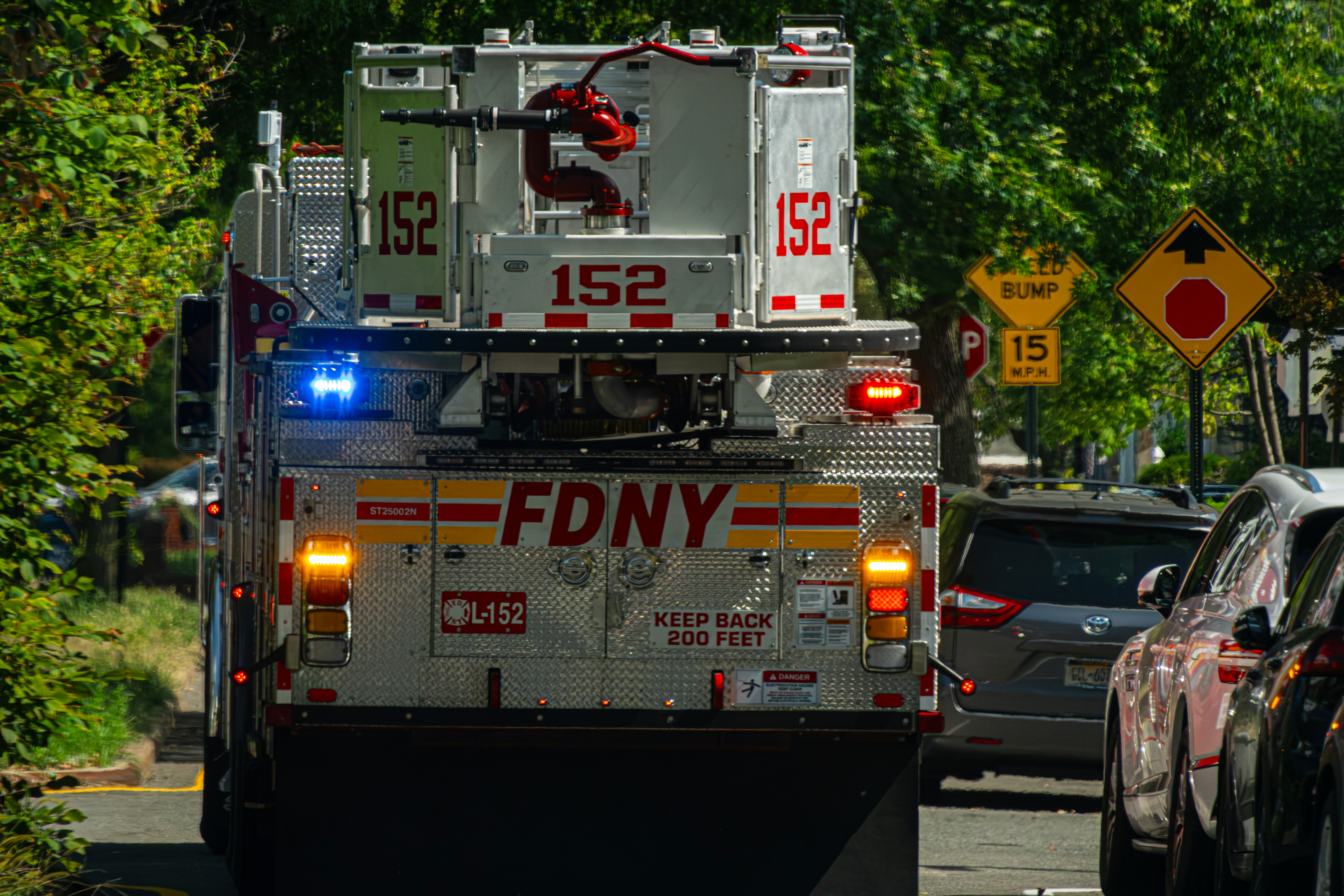 Fdny ladder truck with flashing lights on street