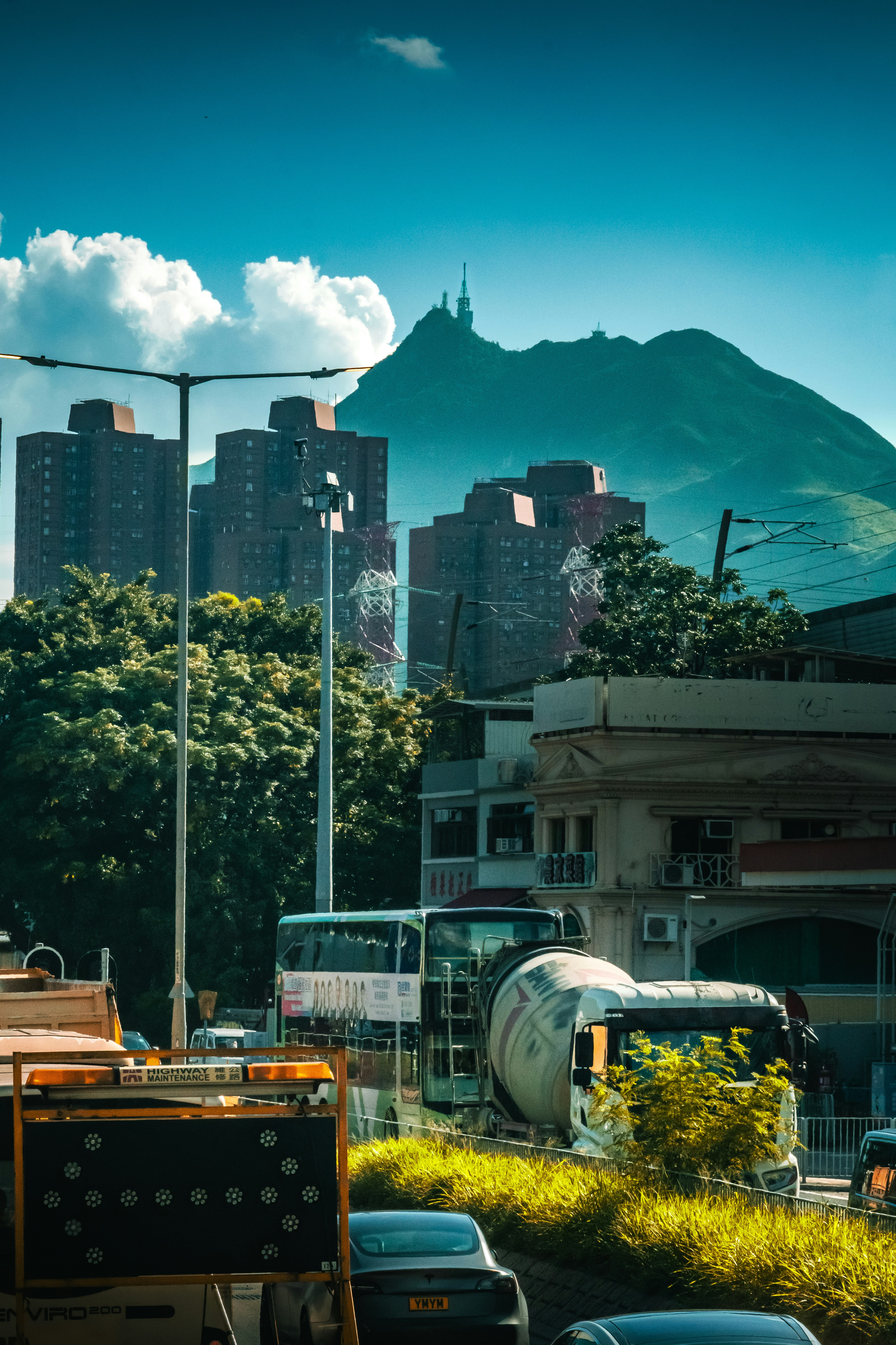 City buildings with mountains in the background.
