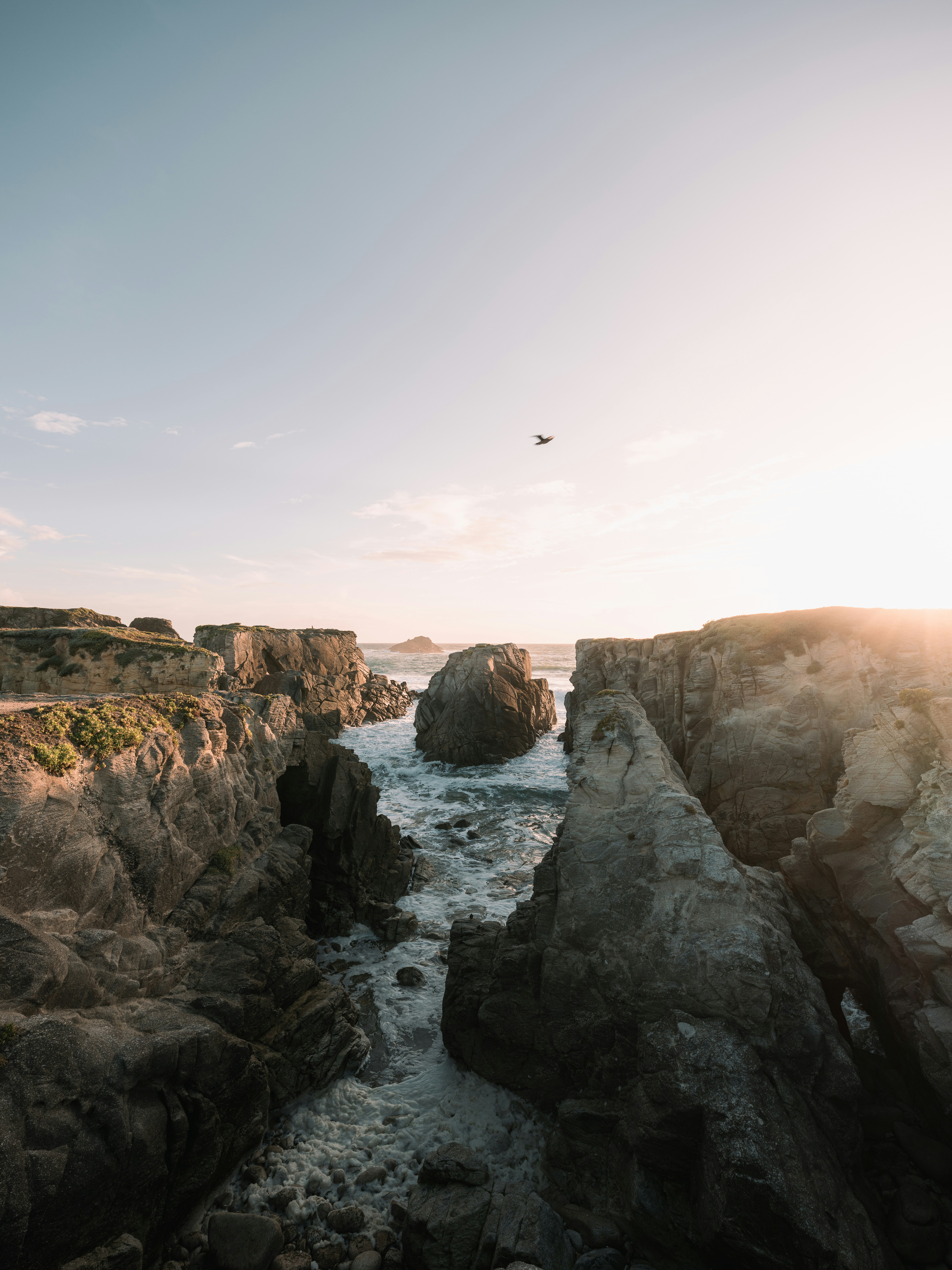Rocky coastline with waves crashing at sunset. photo – Free Image on ...