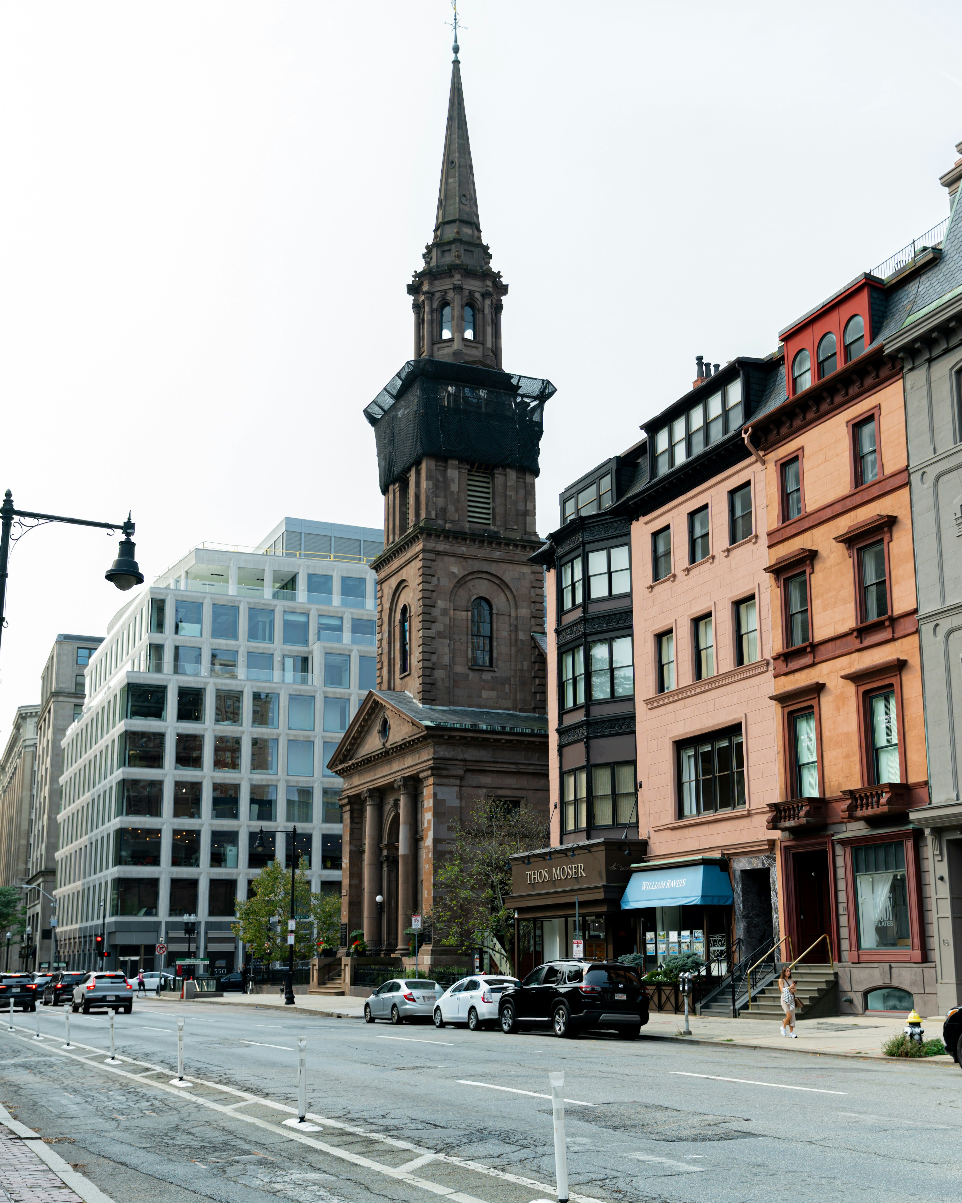 Street view of historic church and colorful buildings.