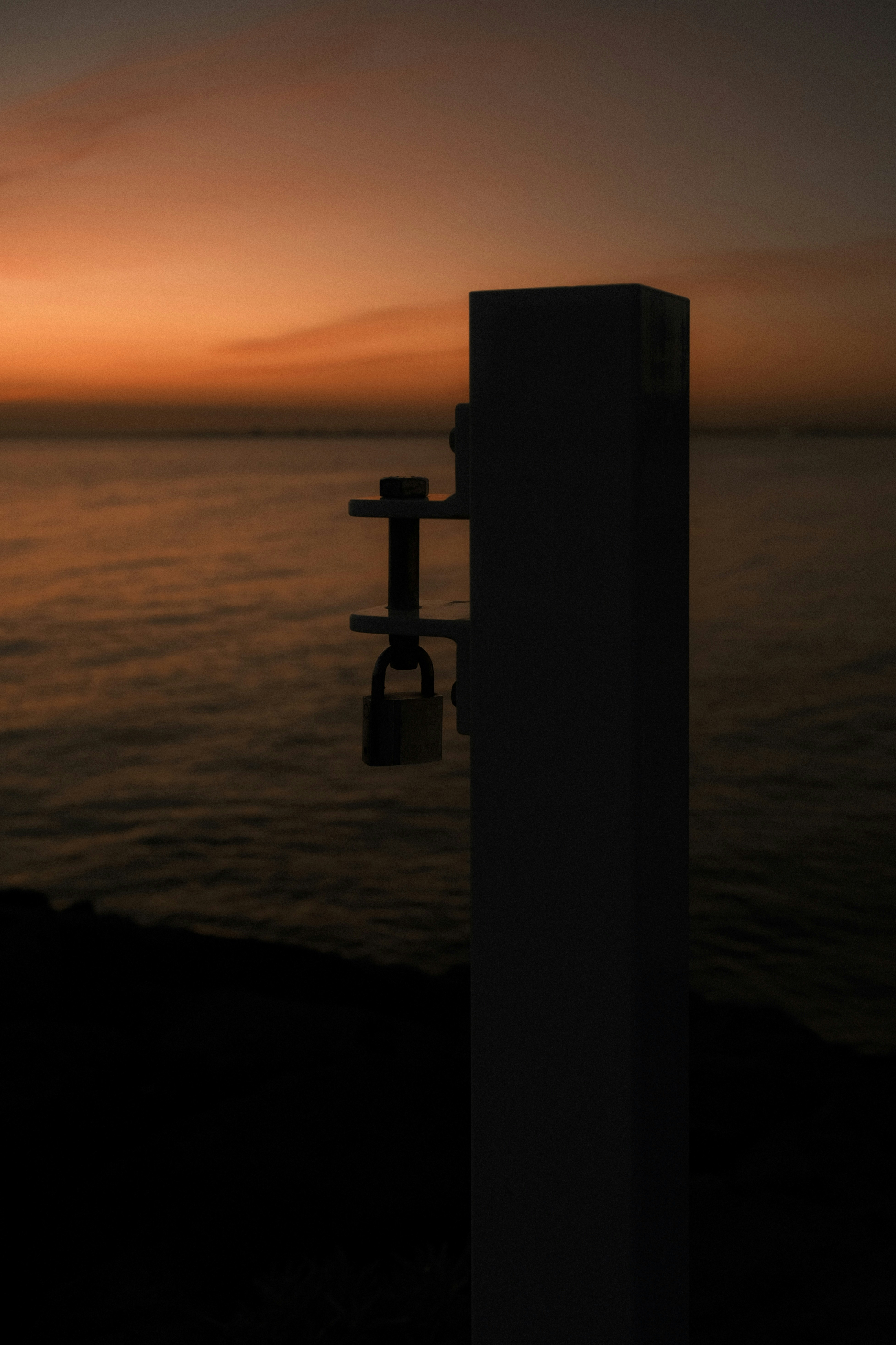 Lock on the Horizon: Sunset Over a Quiet Pier