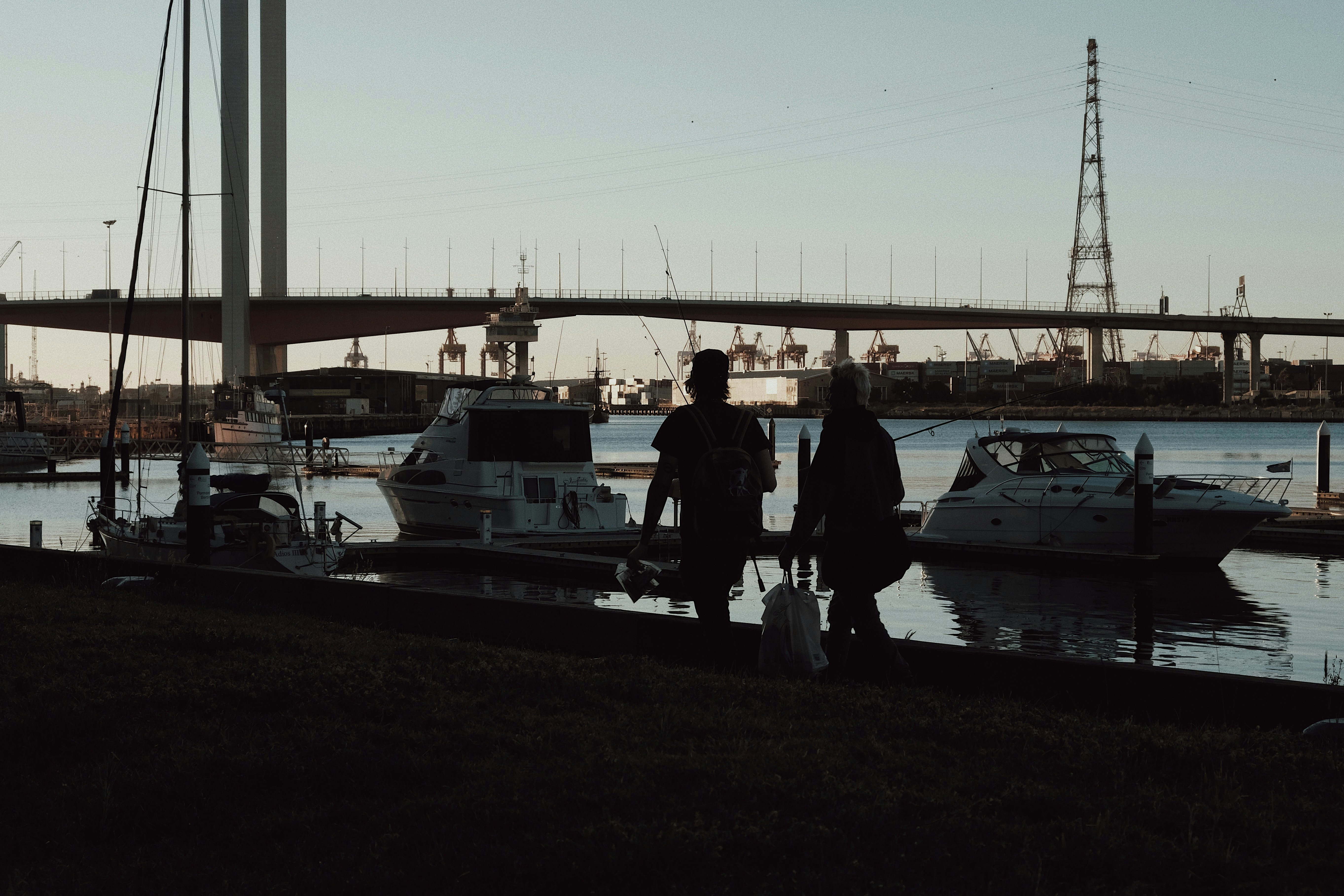 Dusk Stroll by the Marina: Silhouettes, Boats, and a Quiet Bridge