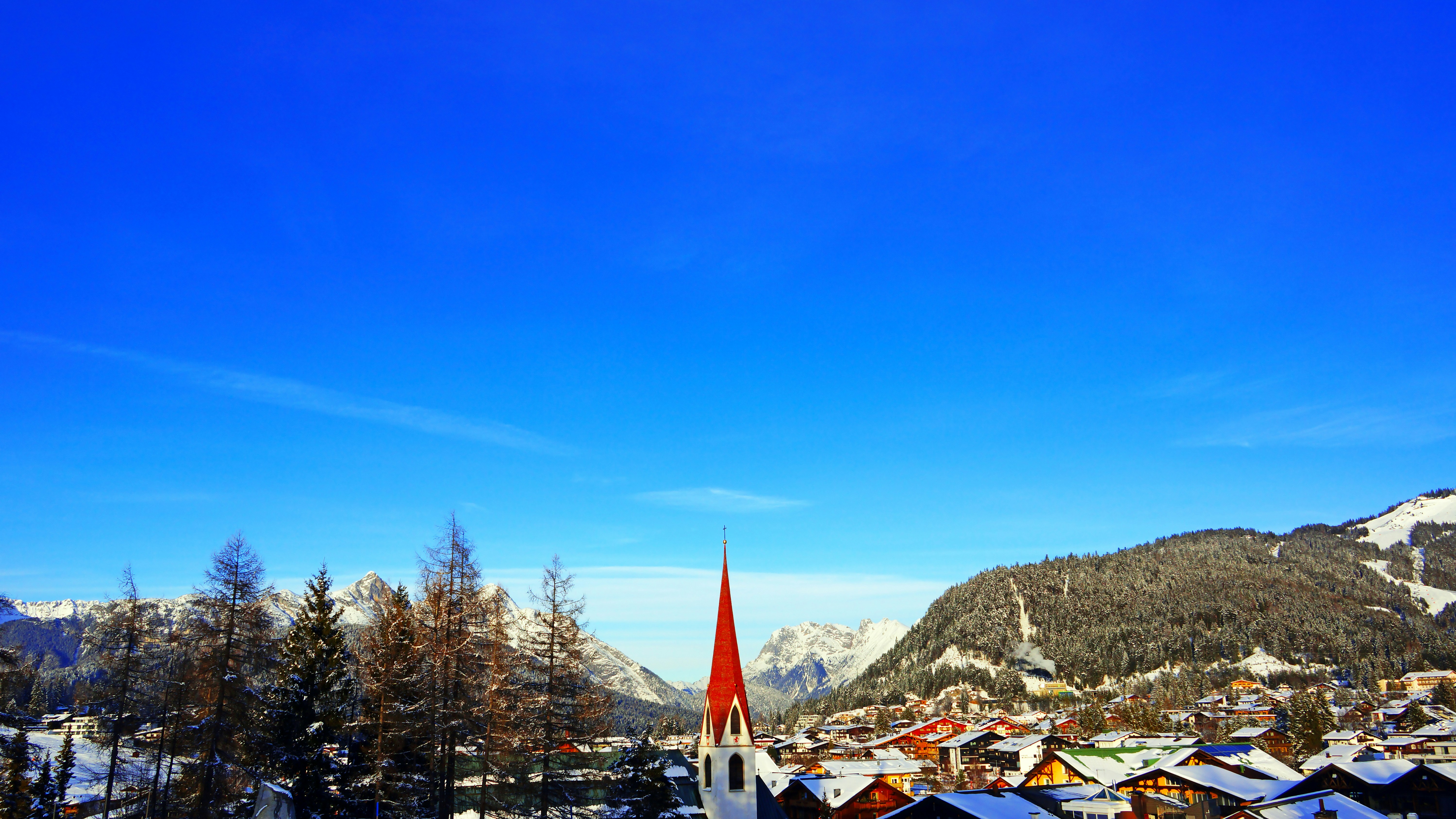 Charming Alpine Village Under a Clear Blue Sky