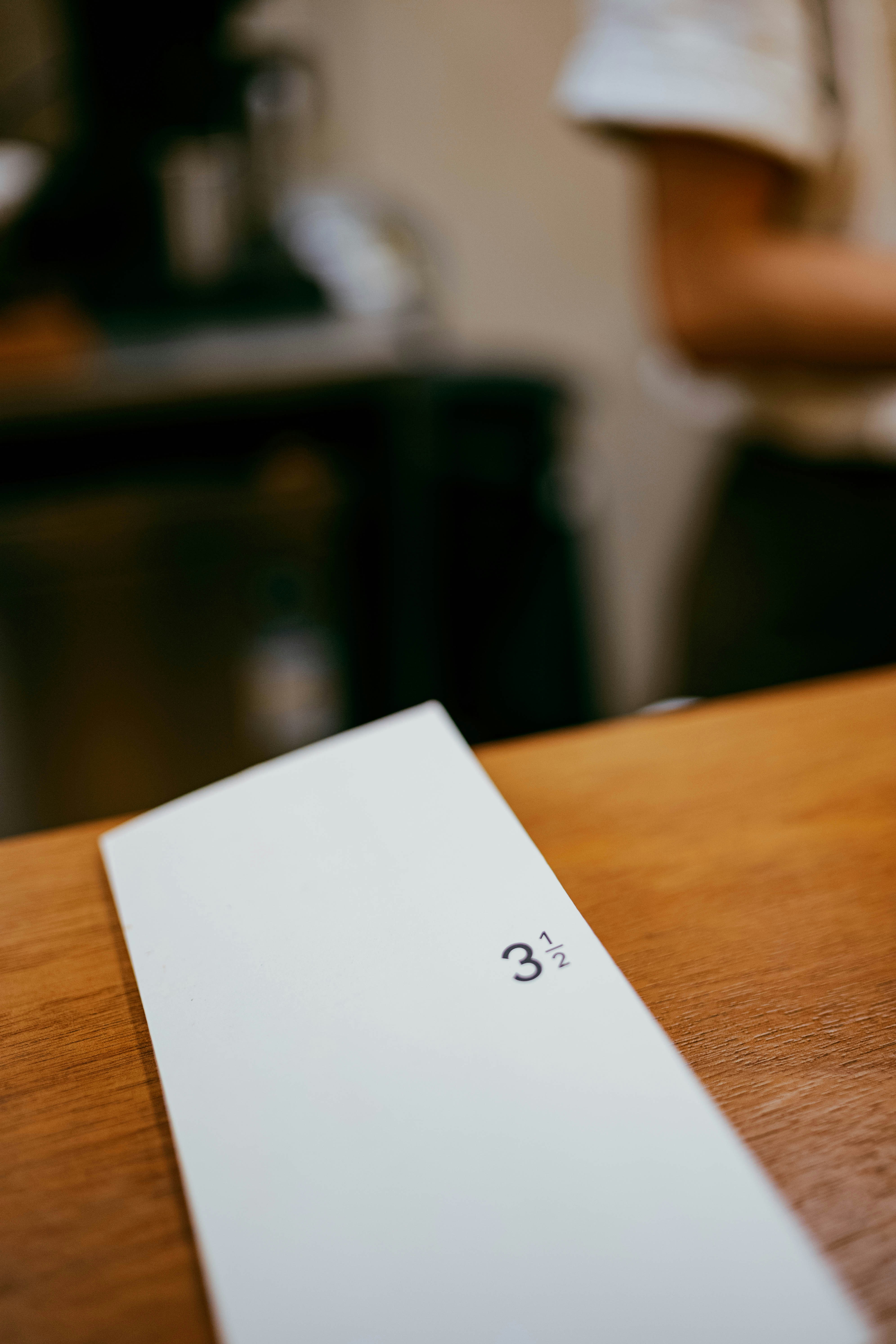 A white card with the number 3 1/2 on it.