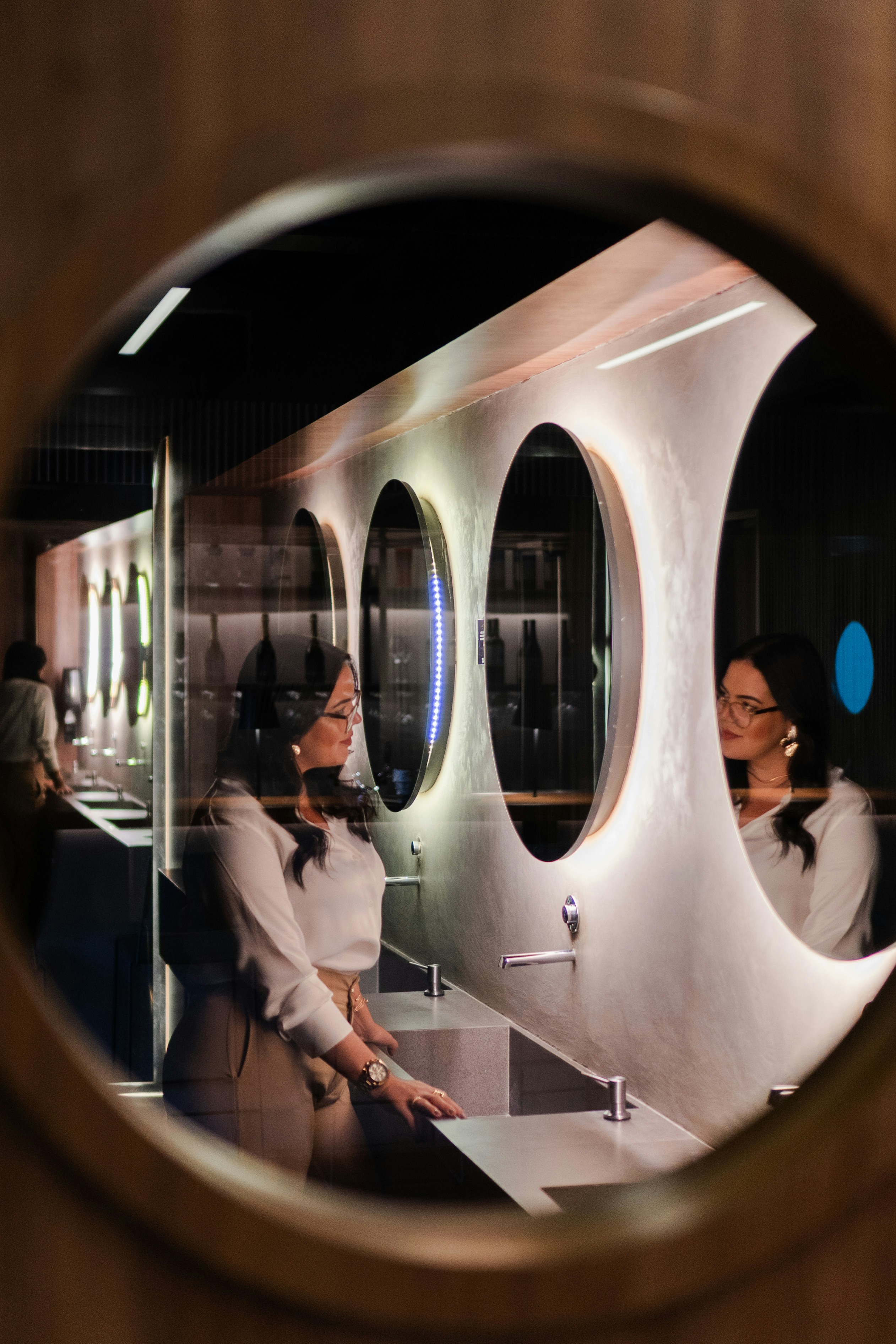 Reflections in a Circular Hall: Portraits Through a Portal