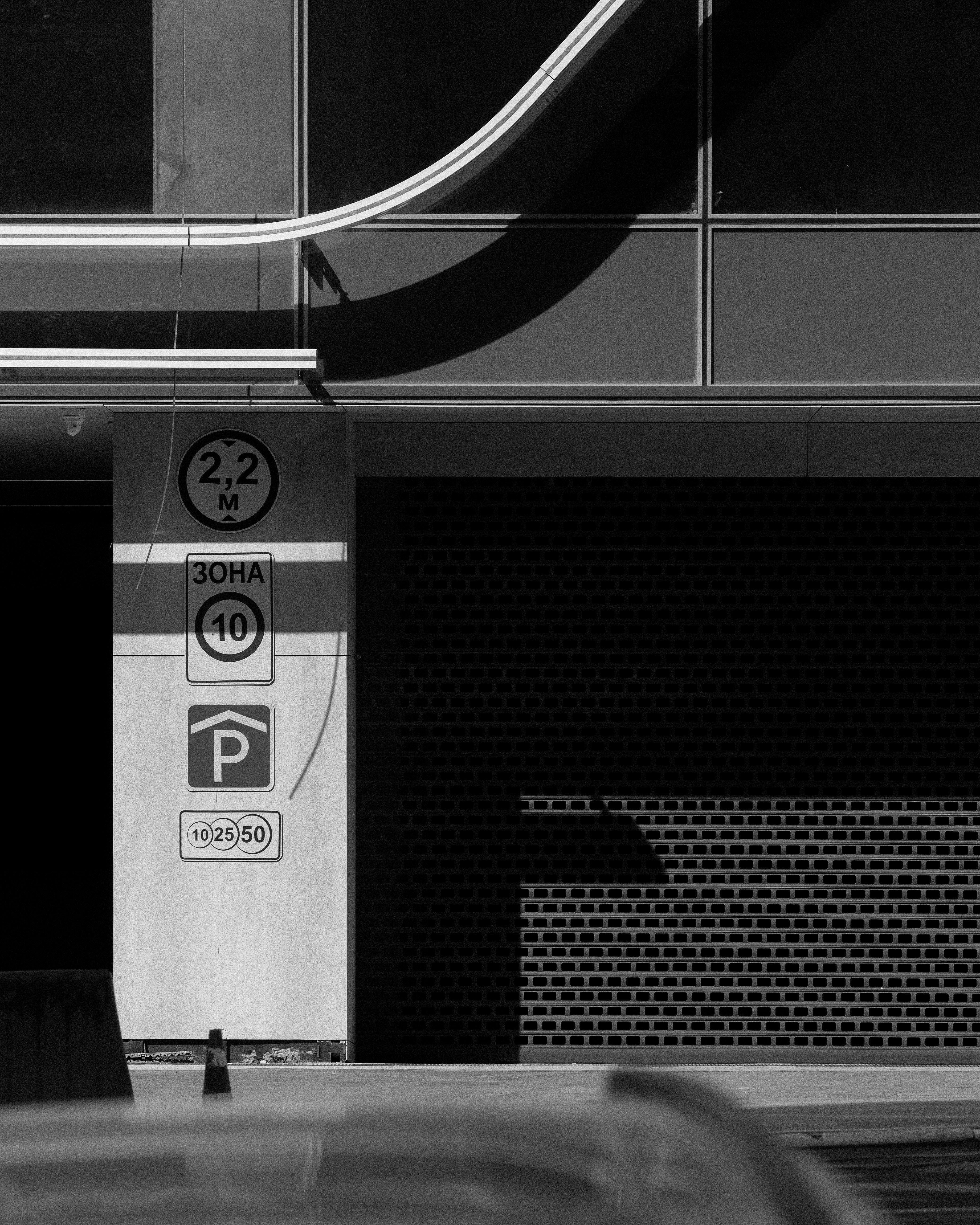 Urban Shadows and Signage: A Study in Monochrome