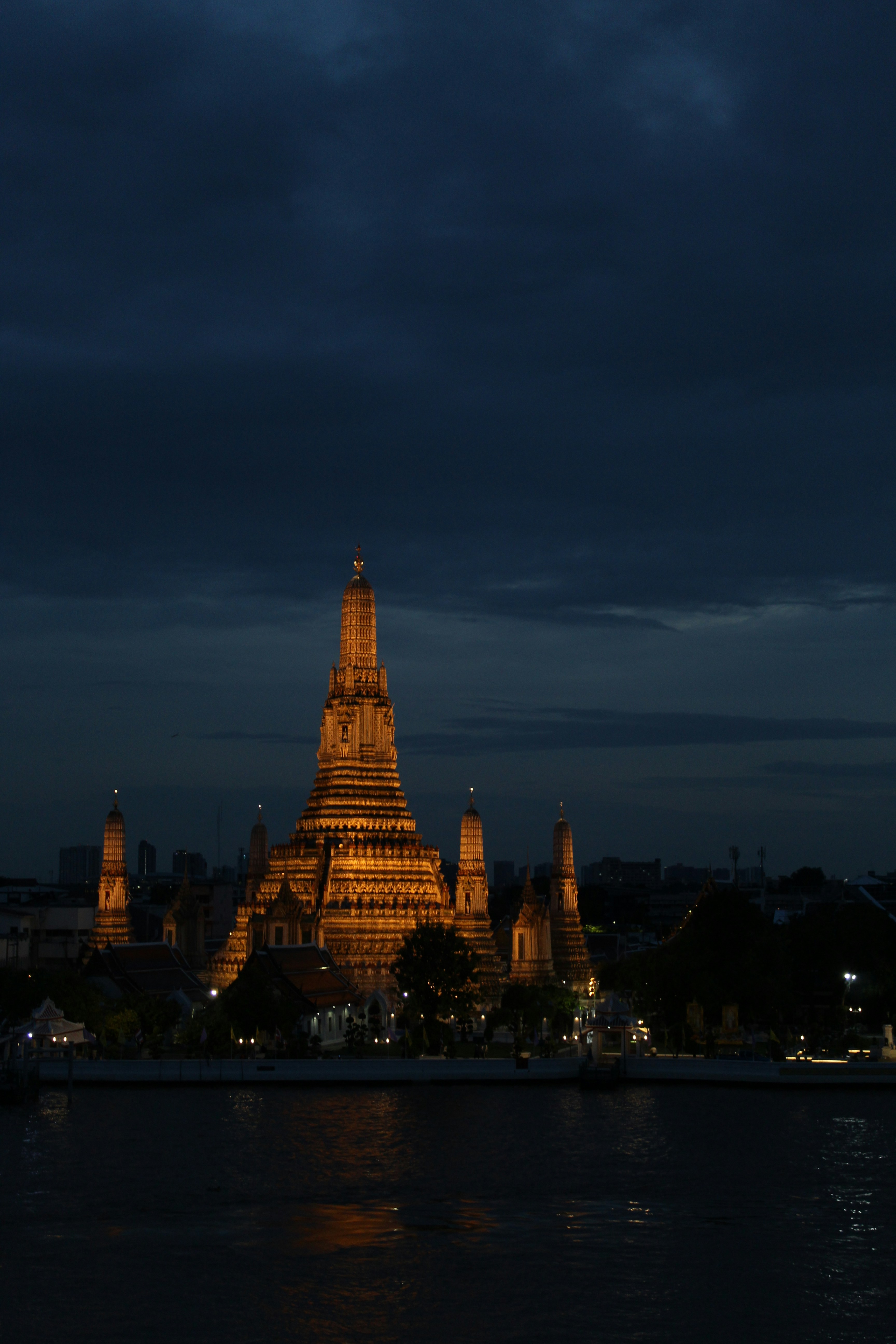 Amber Spire by the River: a night portrait of a Riverside temple