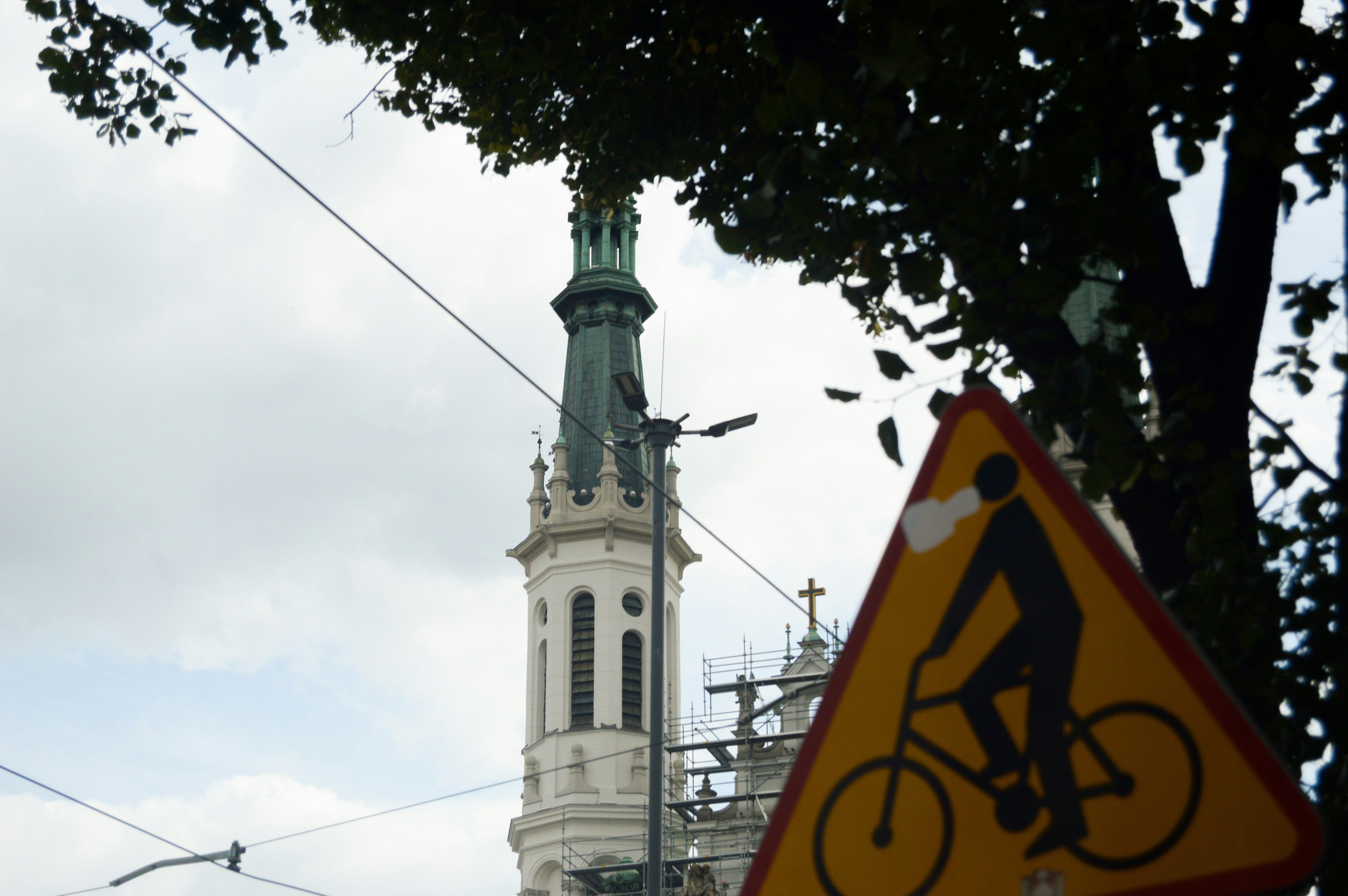 Urban Harmony: A Bicycle's Journey Beneath the Steeple