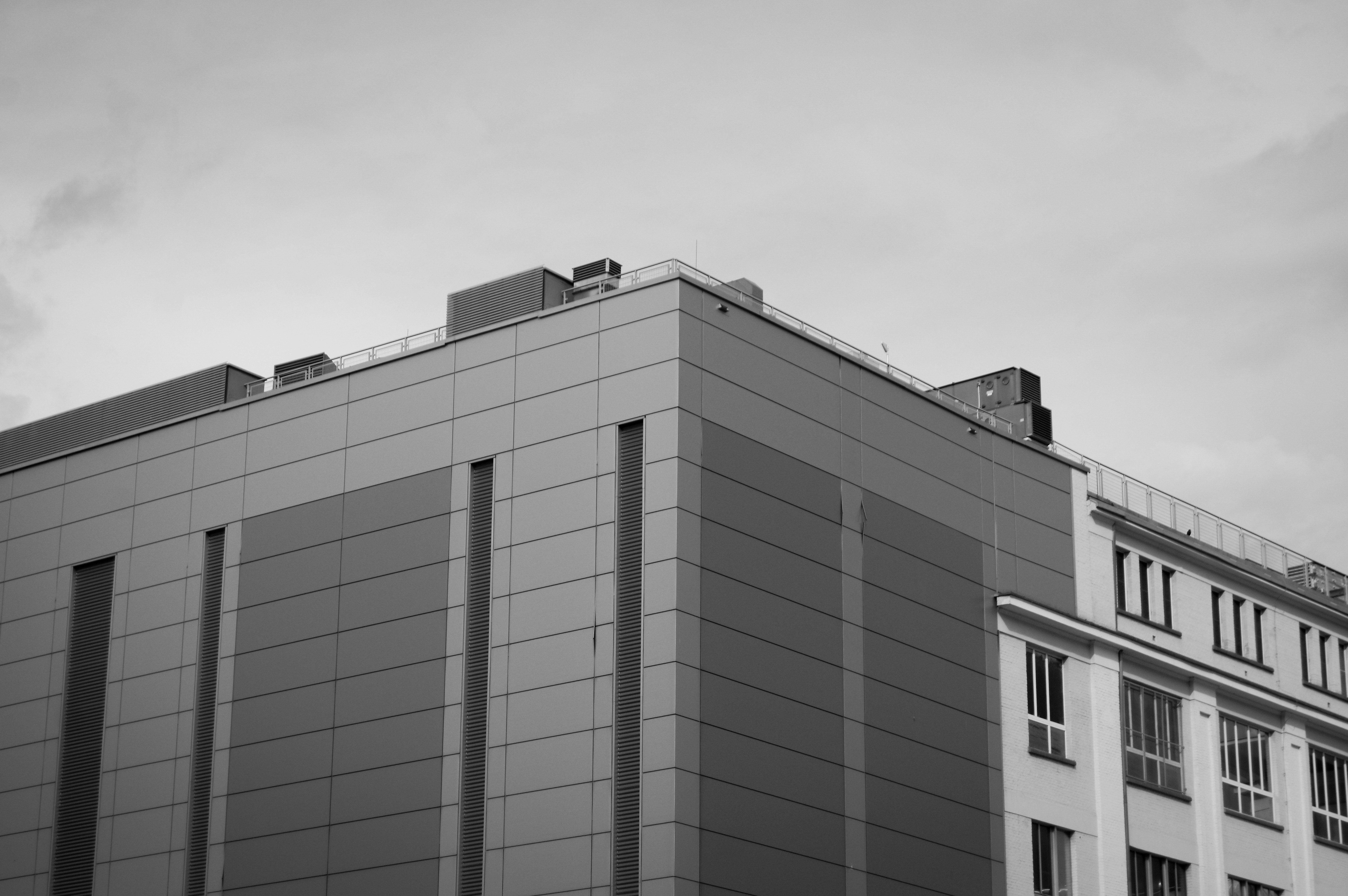 Modern building facade against a cloudy sky