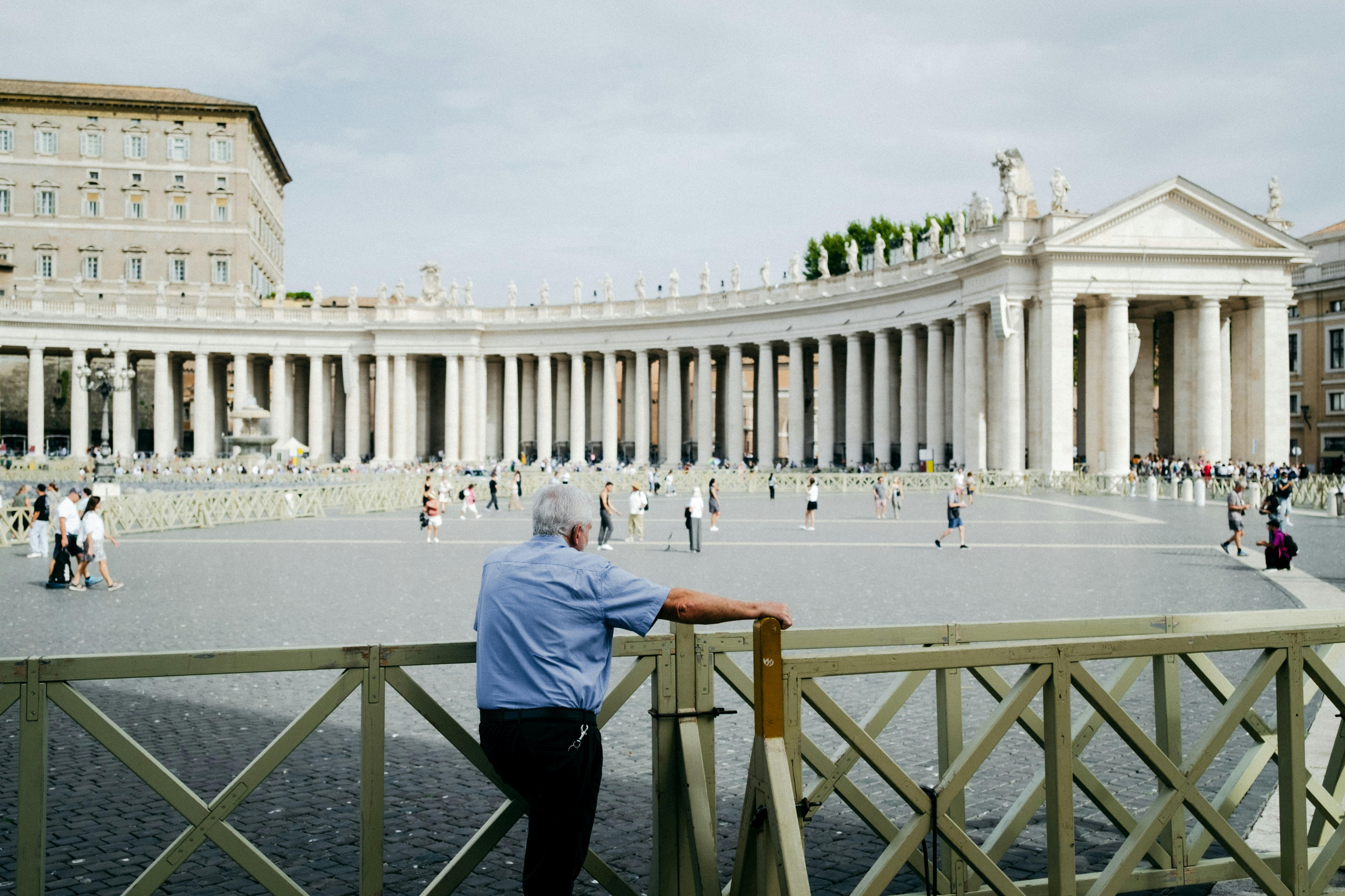 Blue Shirt at the Colonnade: A Quiet Moment in St. Peter's Square