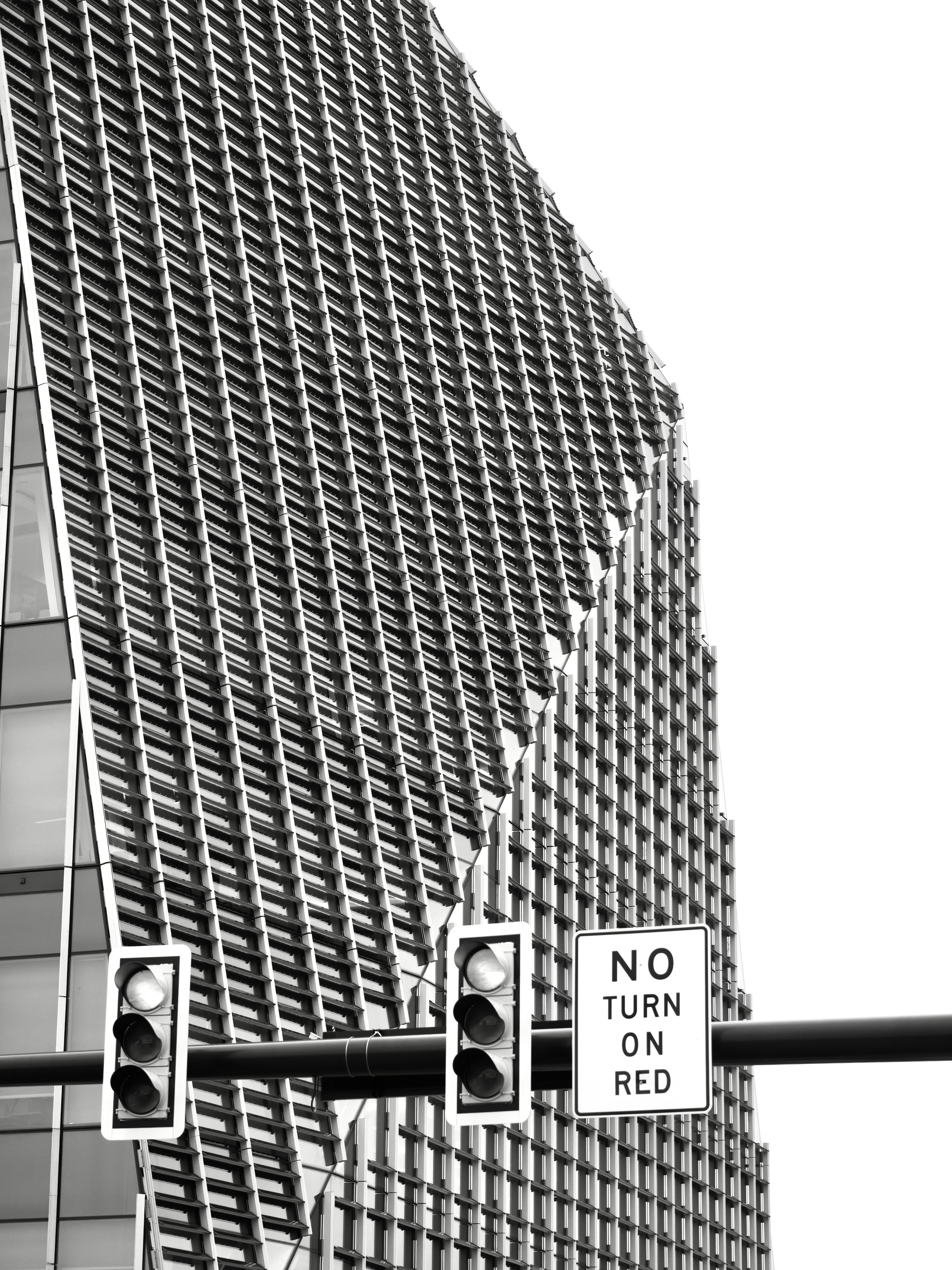 No turn on red sign in front of a modern building