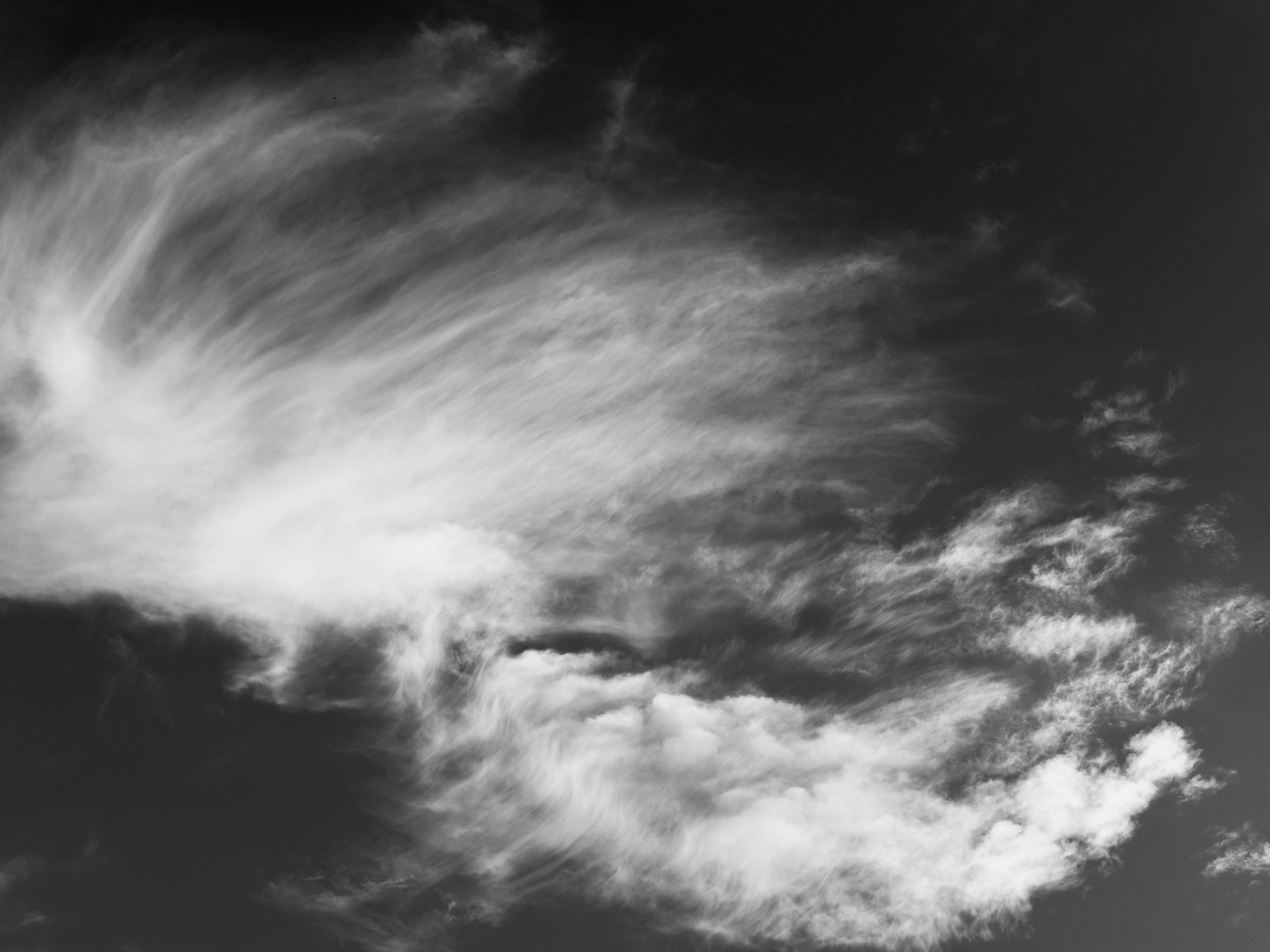 Clouds | Wispy clouds against a dark sky
