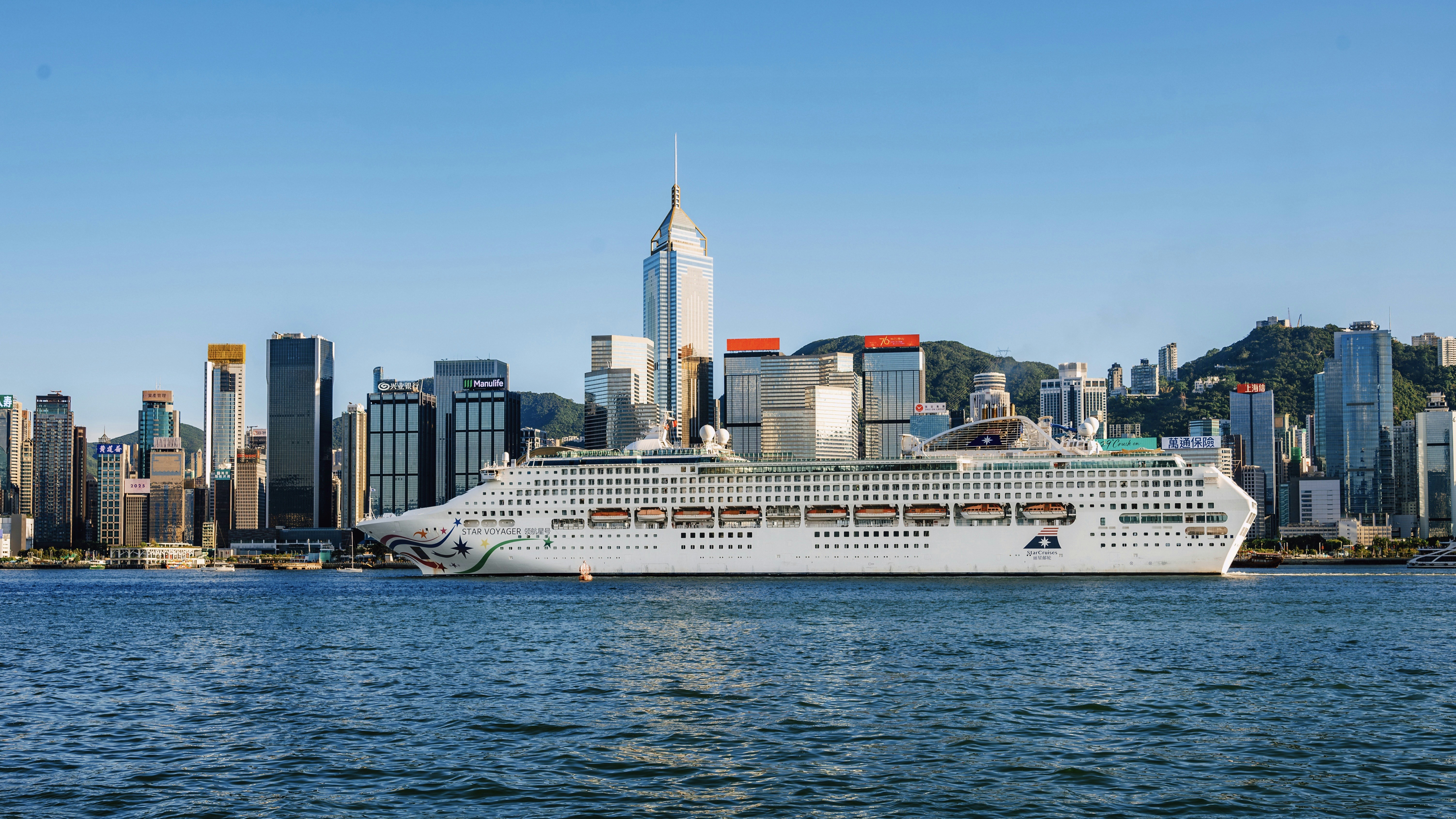 Harbor Majesty: A Cruise Ship Amidst Urban Splendor