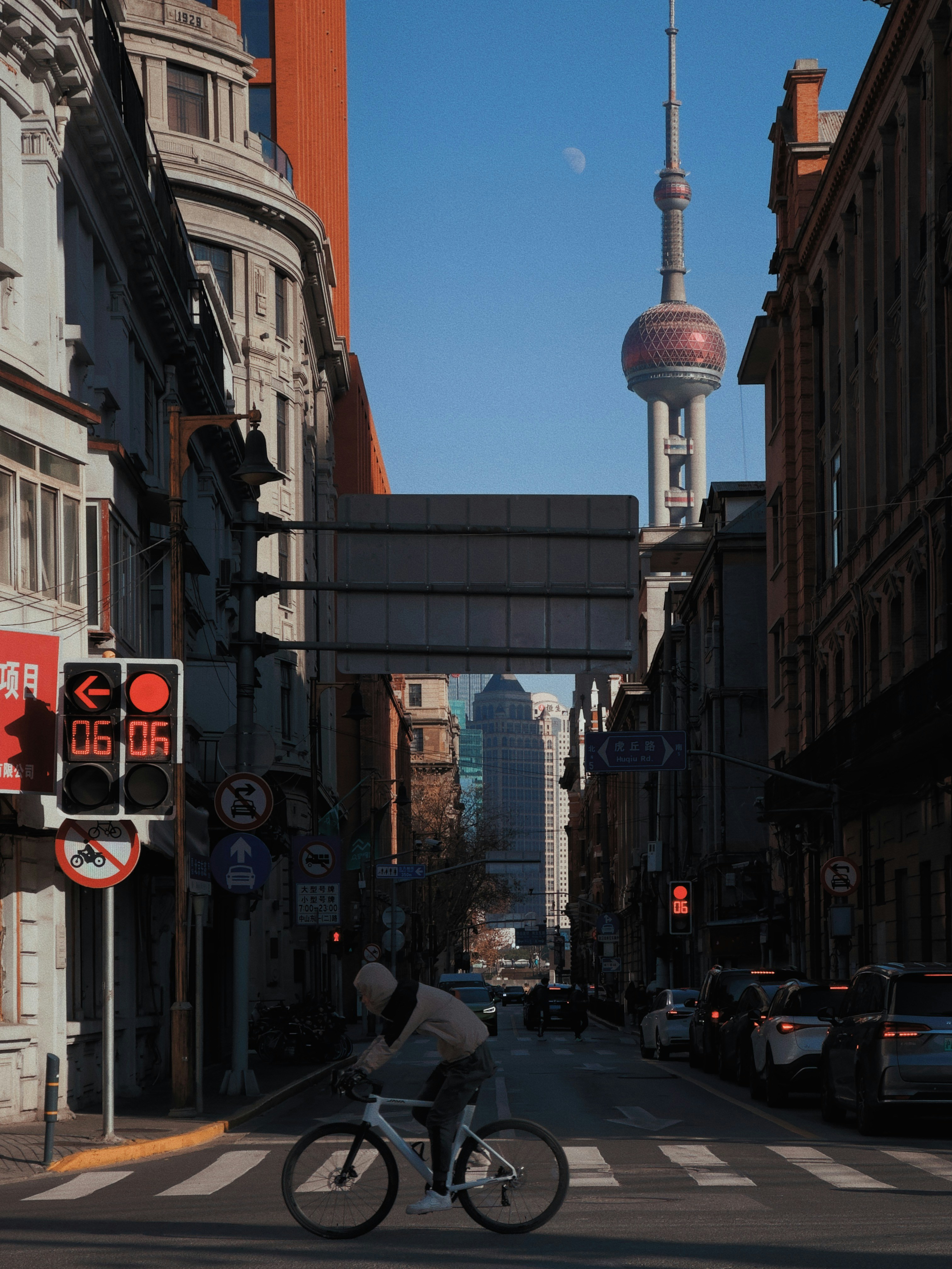 Shanghai Bund. Processed with VSCO with V6 preset | Cyclist crosses street with shanghai skyline background