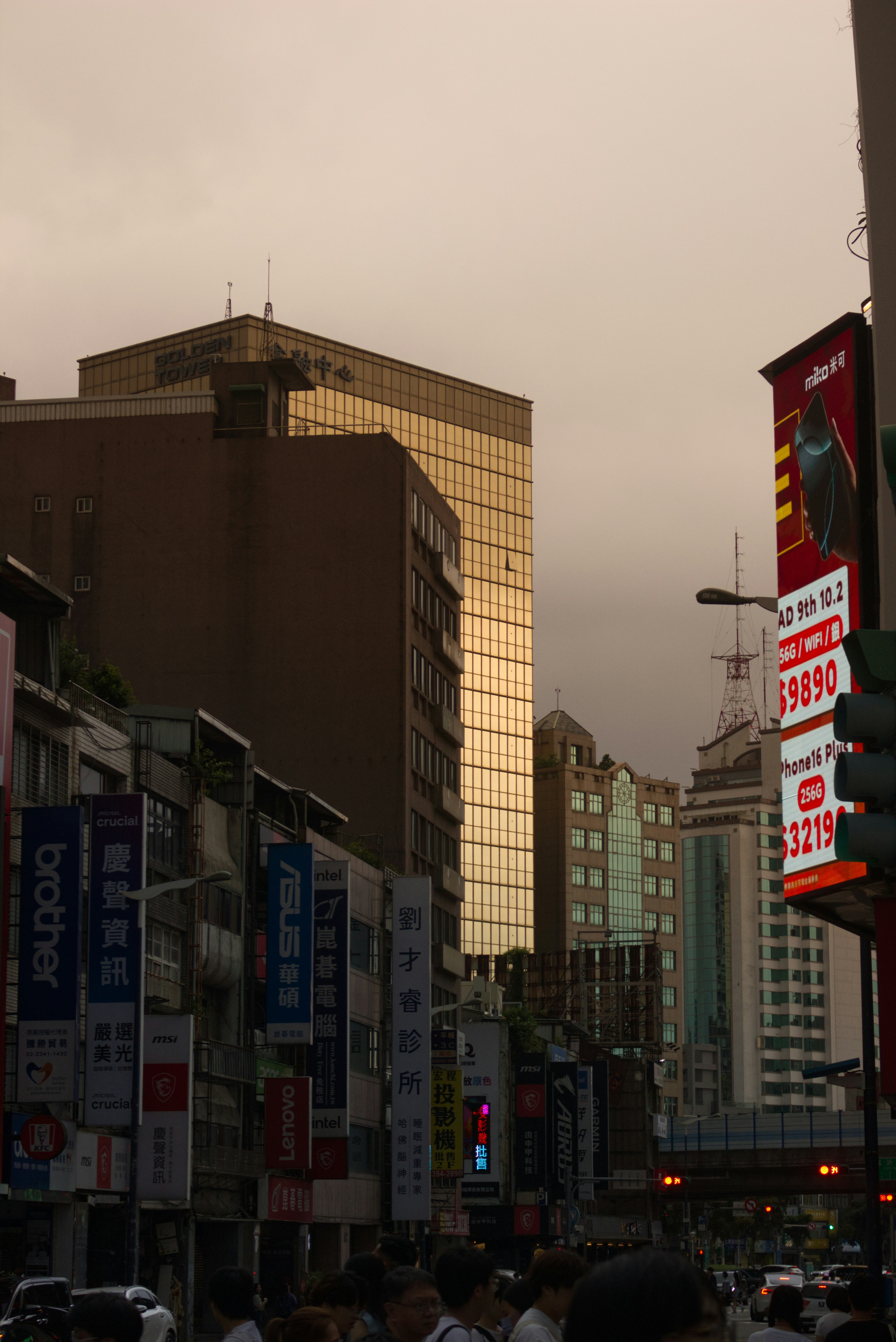 street and building in sunset | Golden skyscraper reflects sunset light in city street.