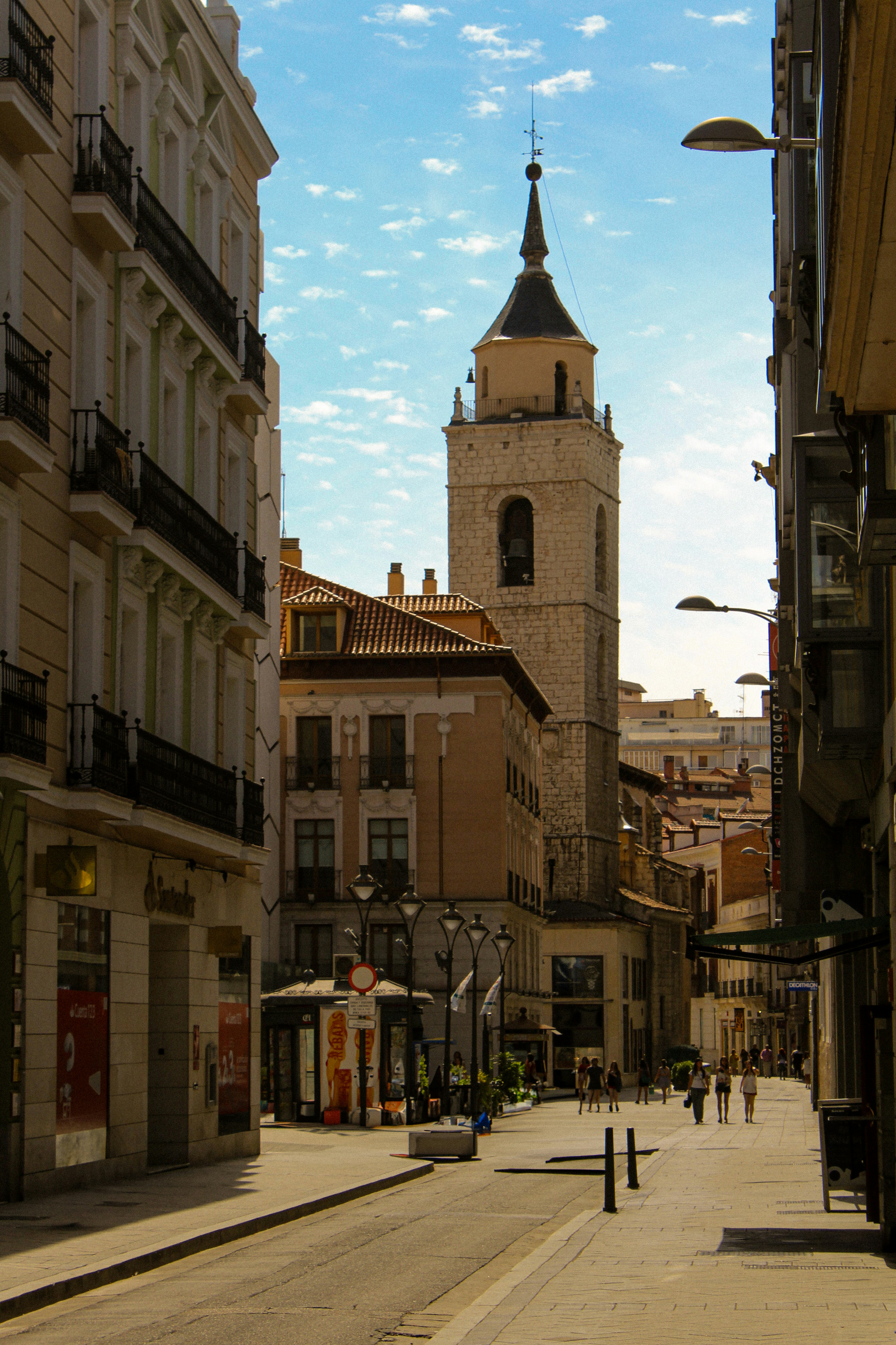 Street scene with tall church tower and buildings