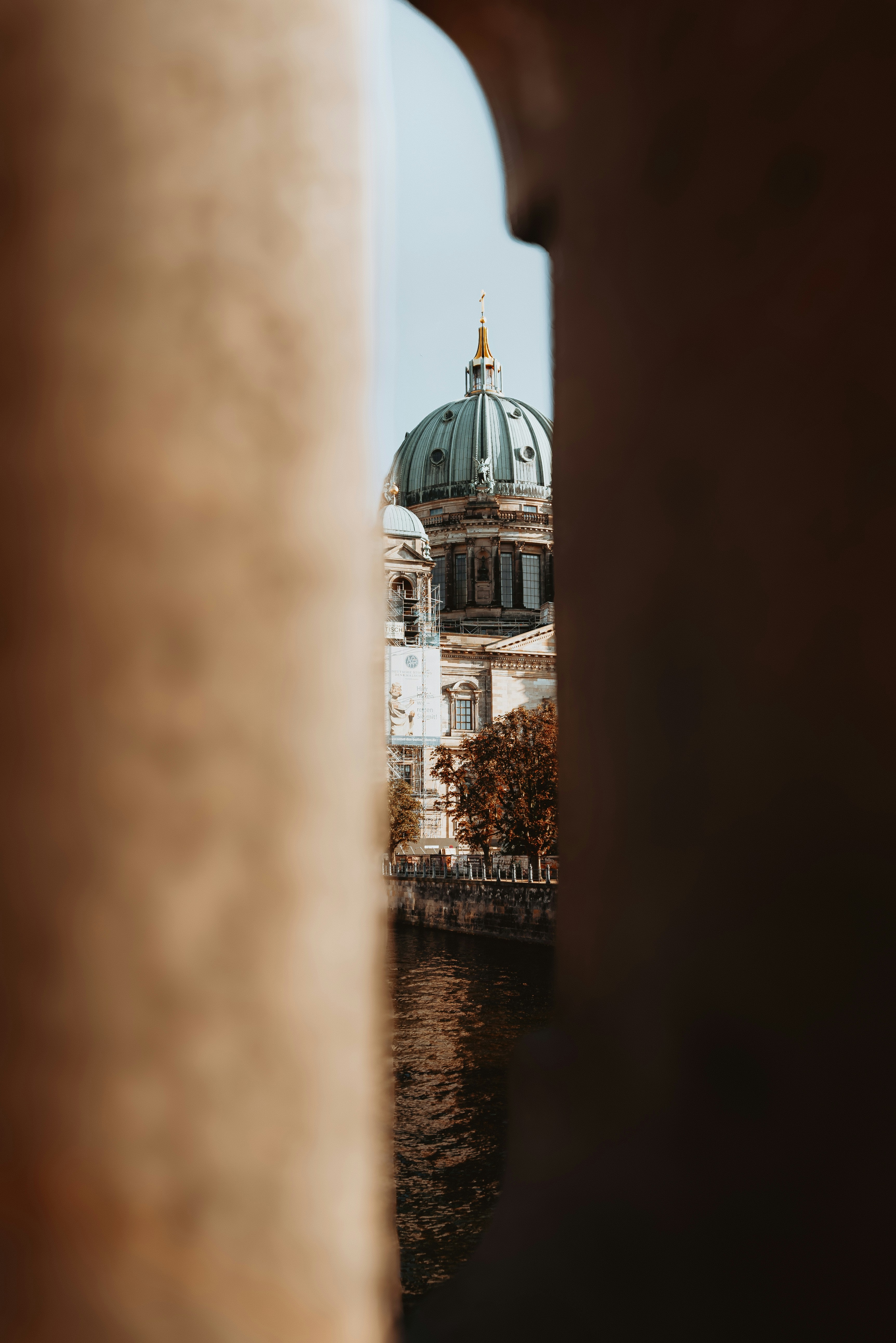 Berlin cathedral seen through an archway