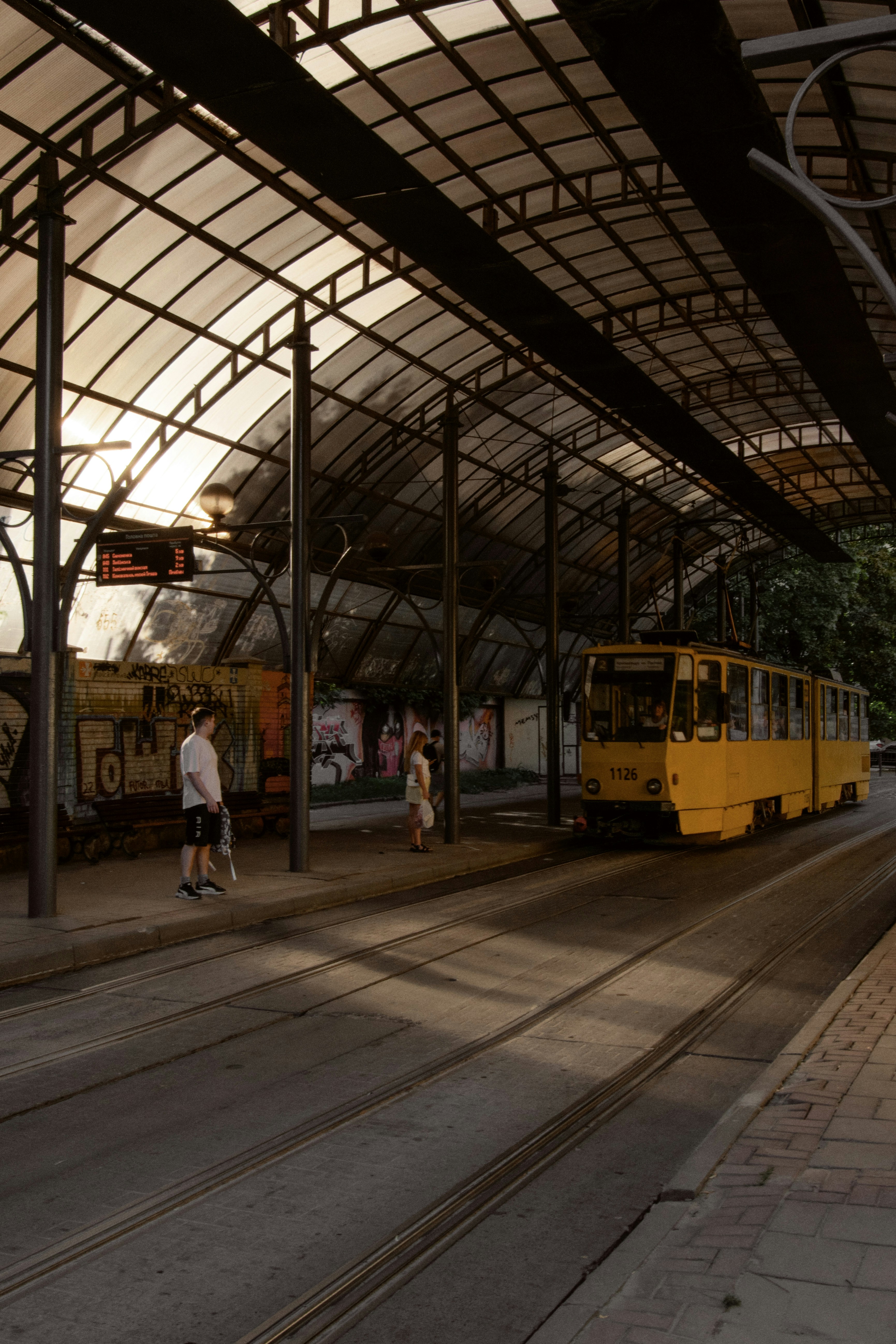 Urban Transit Harmony: A Yellow Tram's Journey