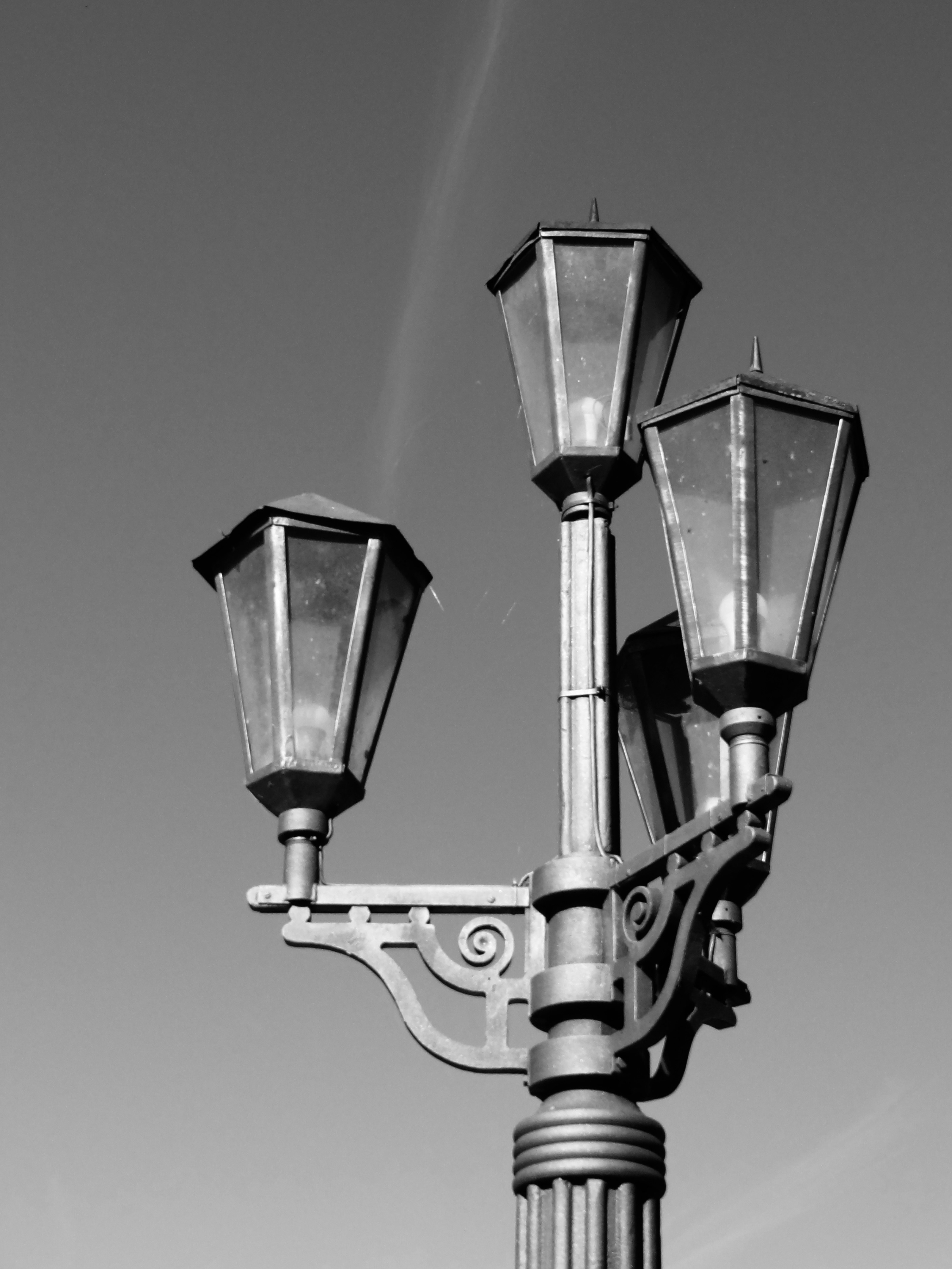 Ornate vintage street lamp against a clear sky