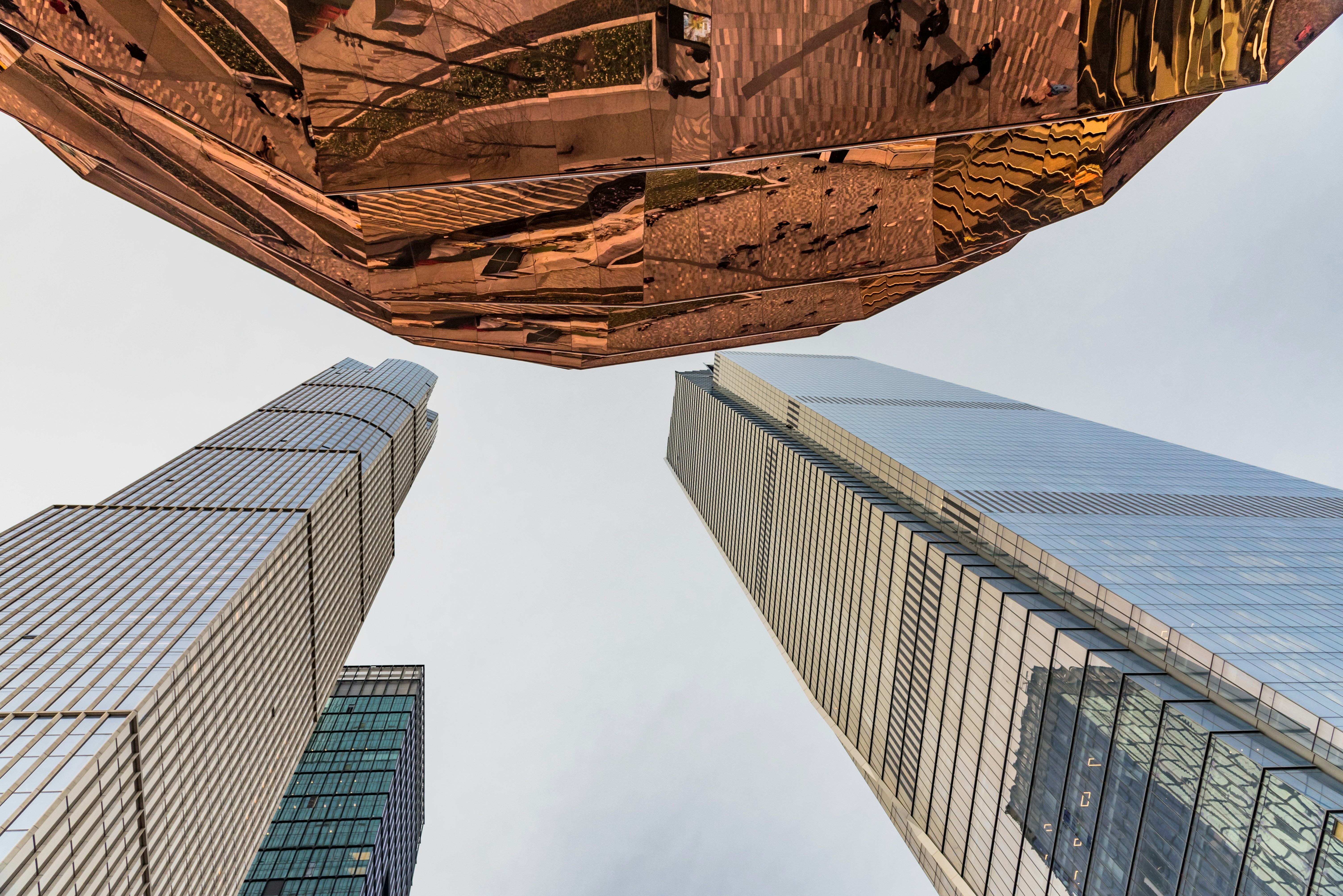 Looking up at modern skyscrapers and unique architecture