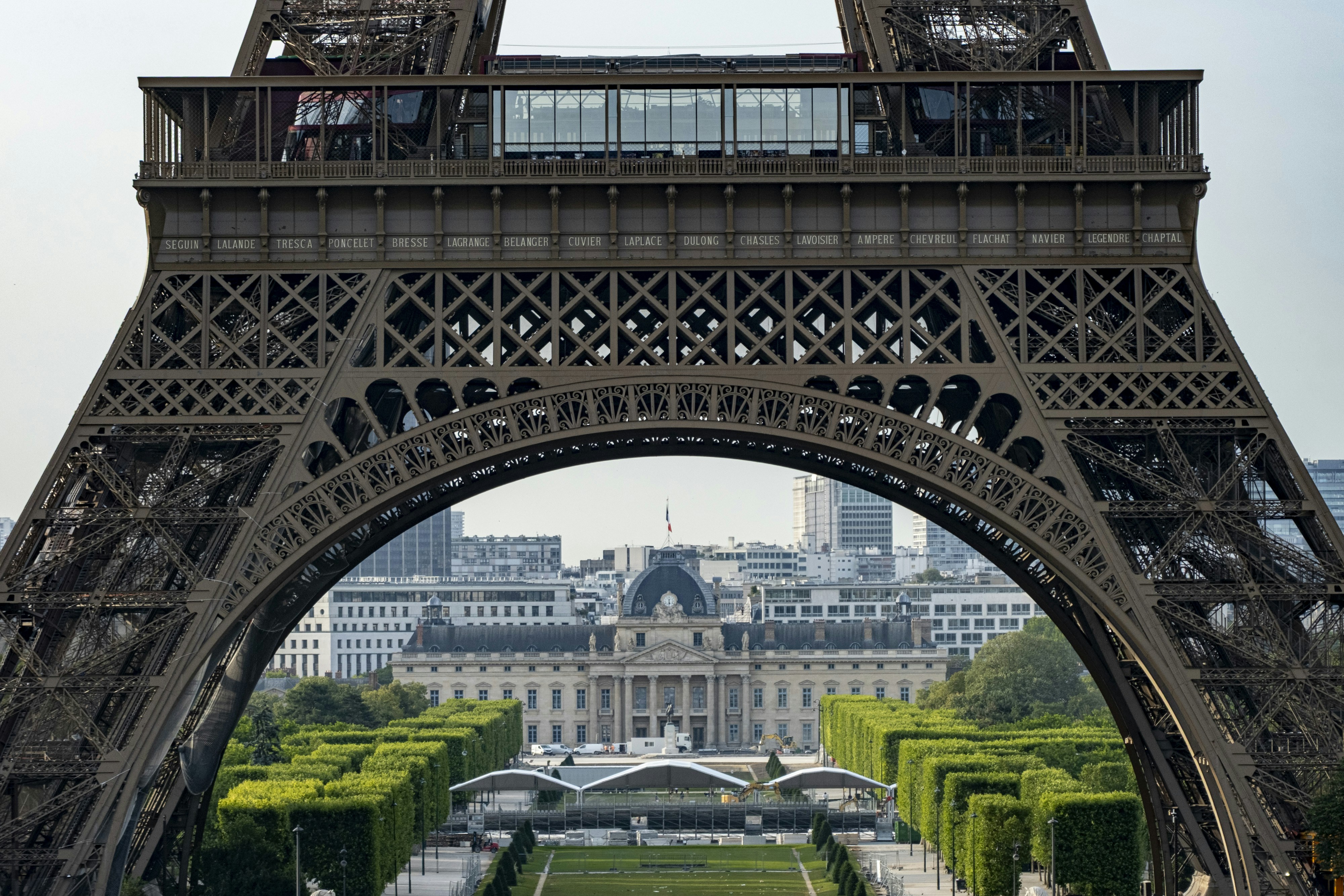 Through the Iron Lace: A Parisian Garden Framed by the Eiffel Tower