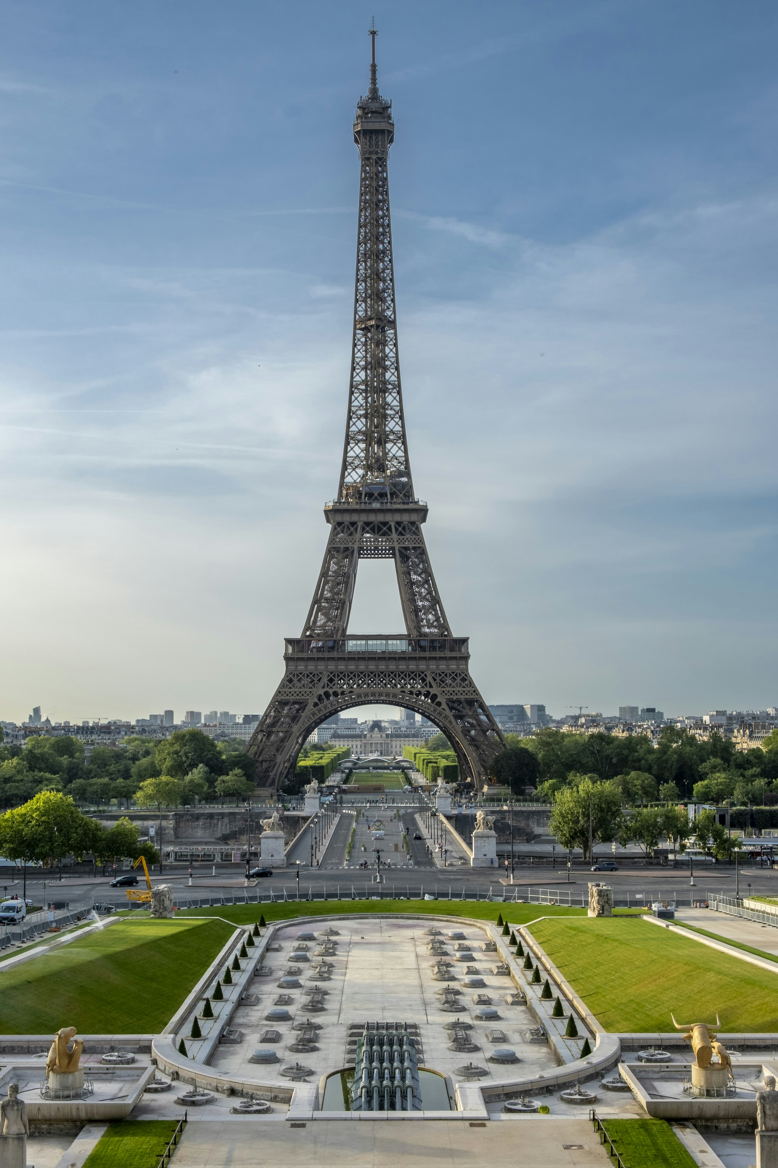 The eiffel tower stands tall against a blue sky.