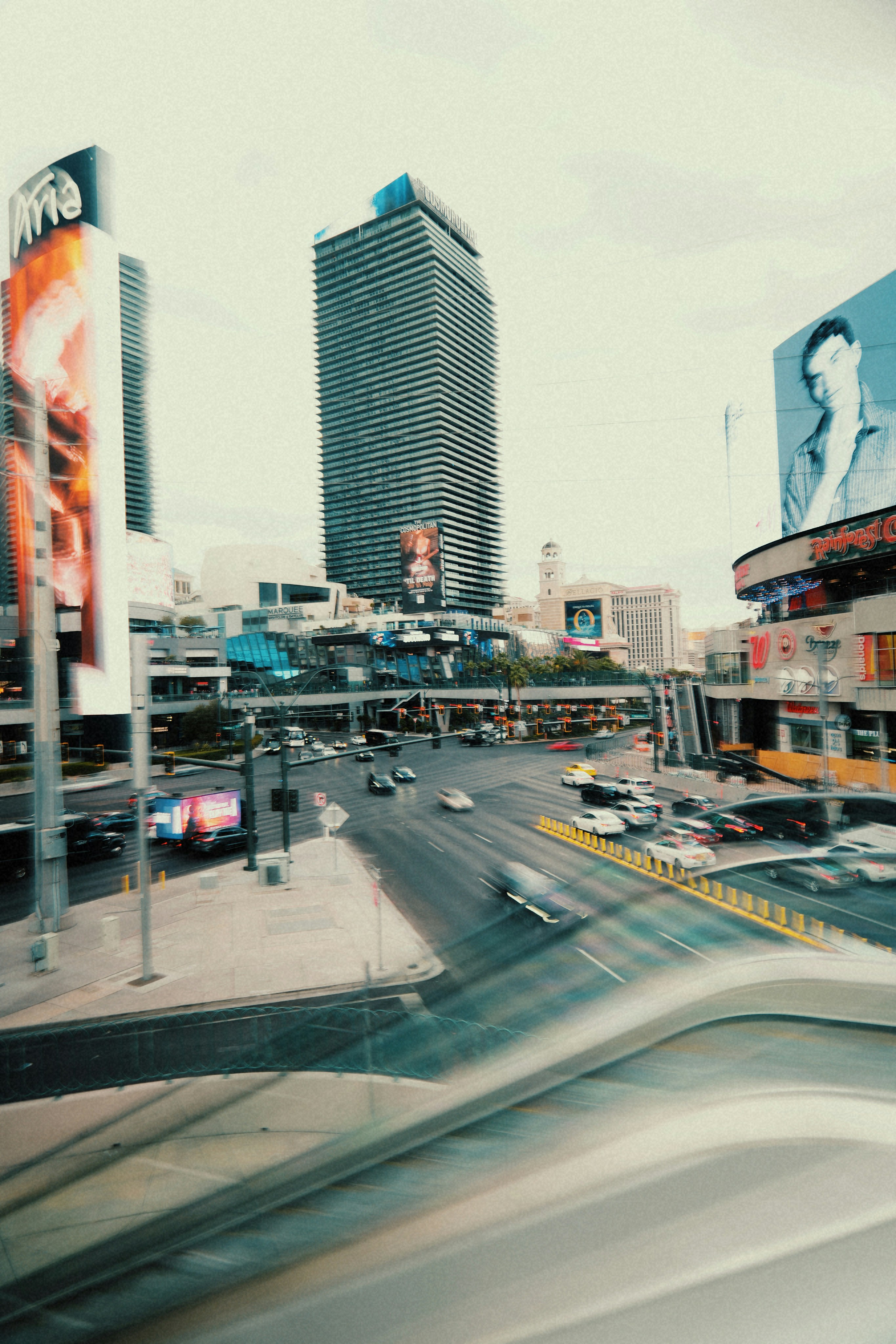 Neon Crossroads in Transit: A Blur-Rendered Downtown Skyline