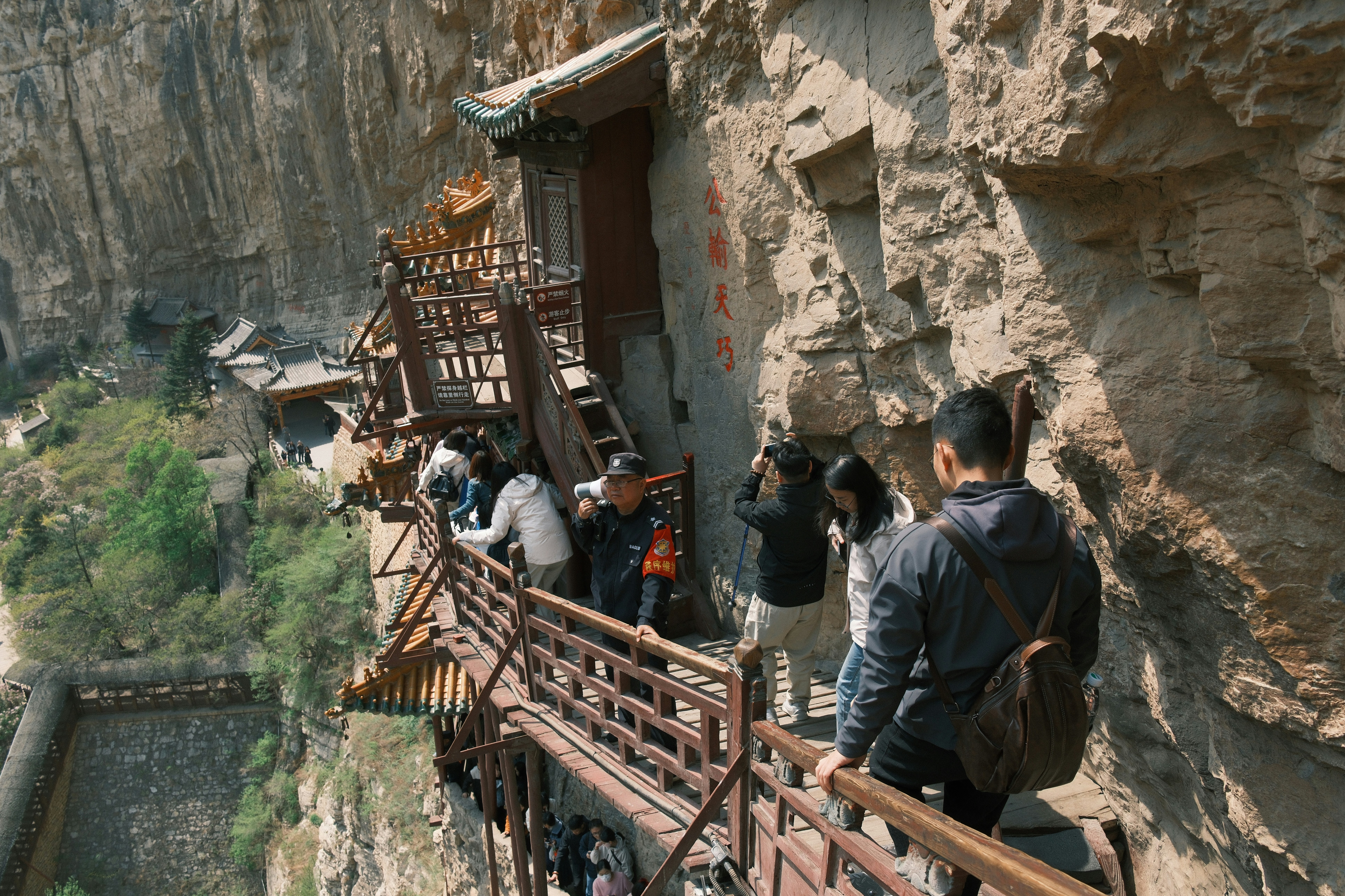 Edgeway Corridor: Tourists on a cliffside wooden balcony