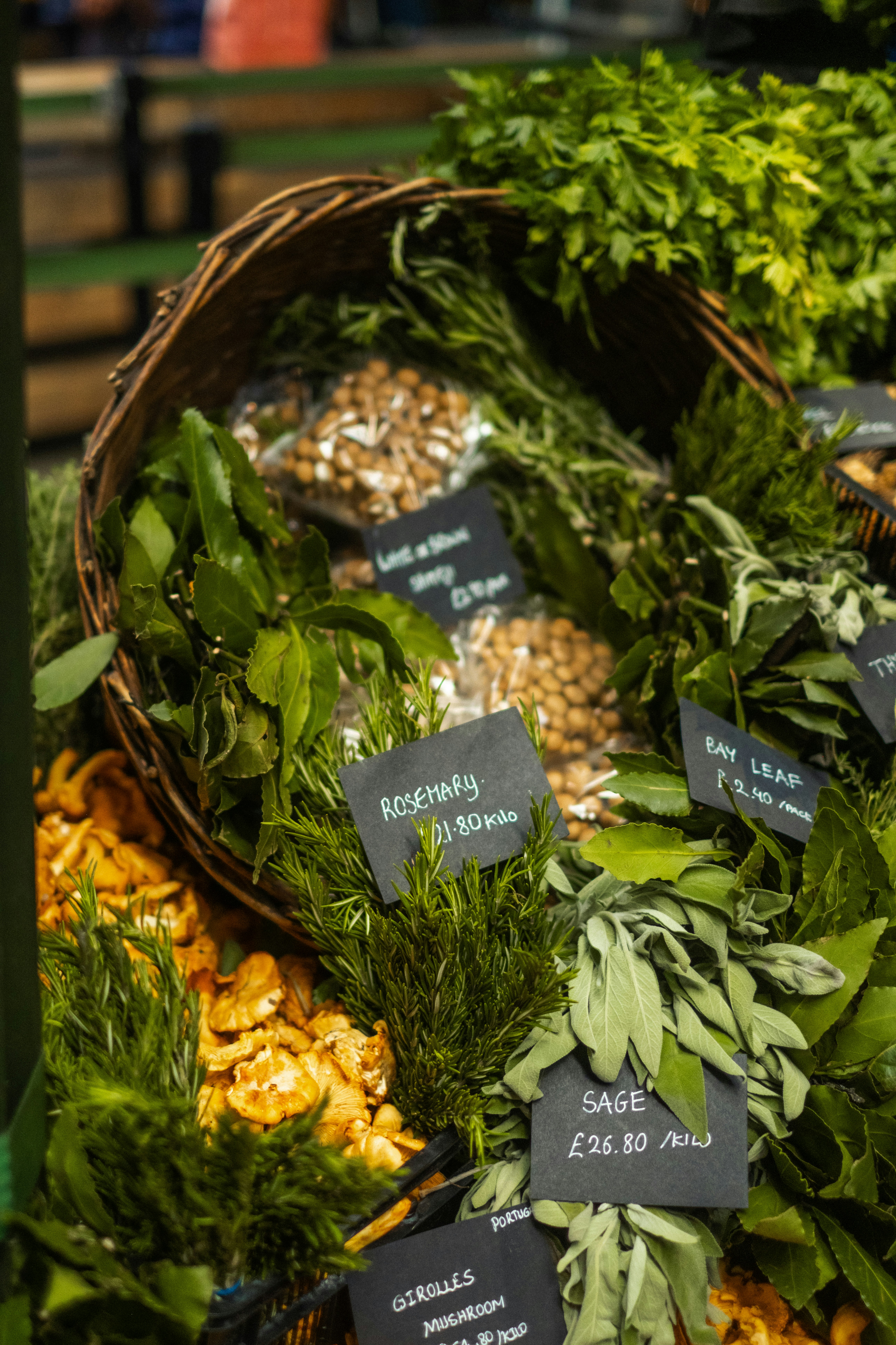 Fresh herbs on display at the Borough Market, London. | Fresh herbs and dried goods displayed at market.