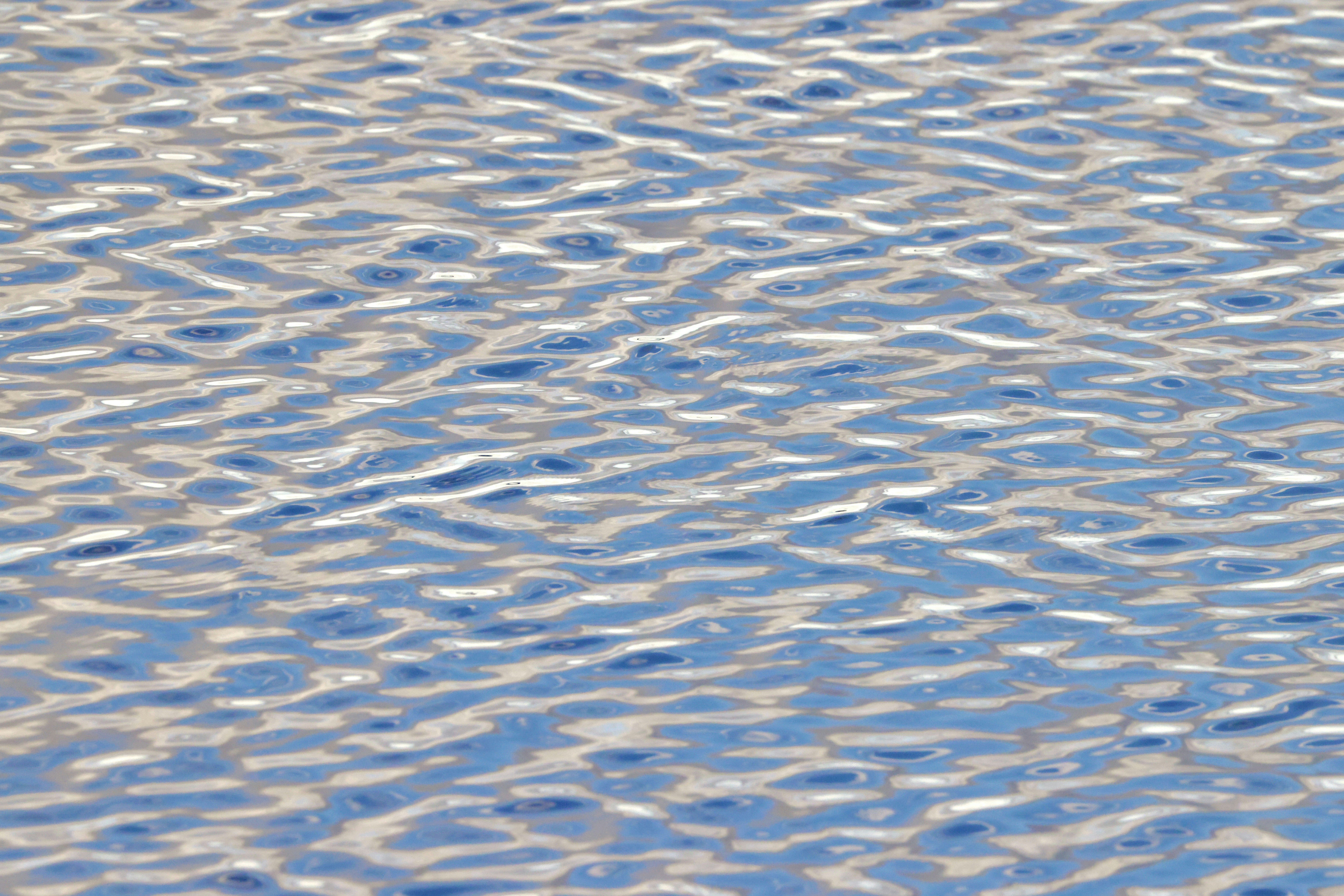 Lake abstract | Rippling blue water surface with light reflections