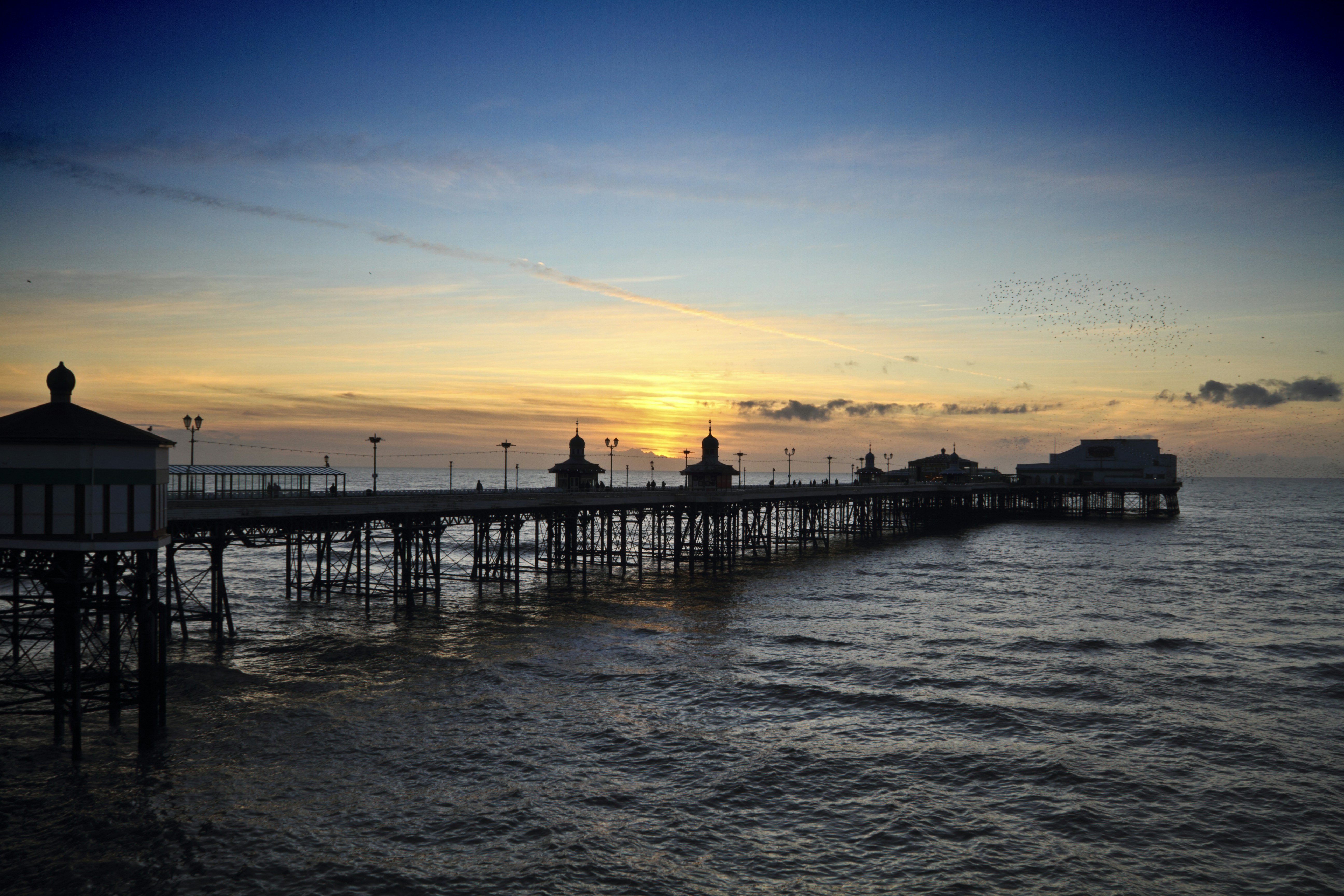 Michael Beckwith www.beckwithphotography.com | Sunset over a pier on the ocean