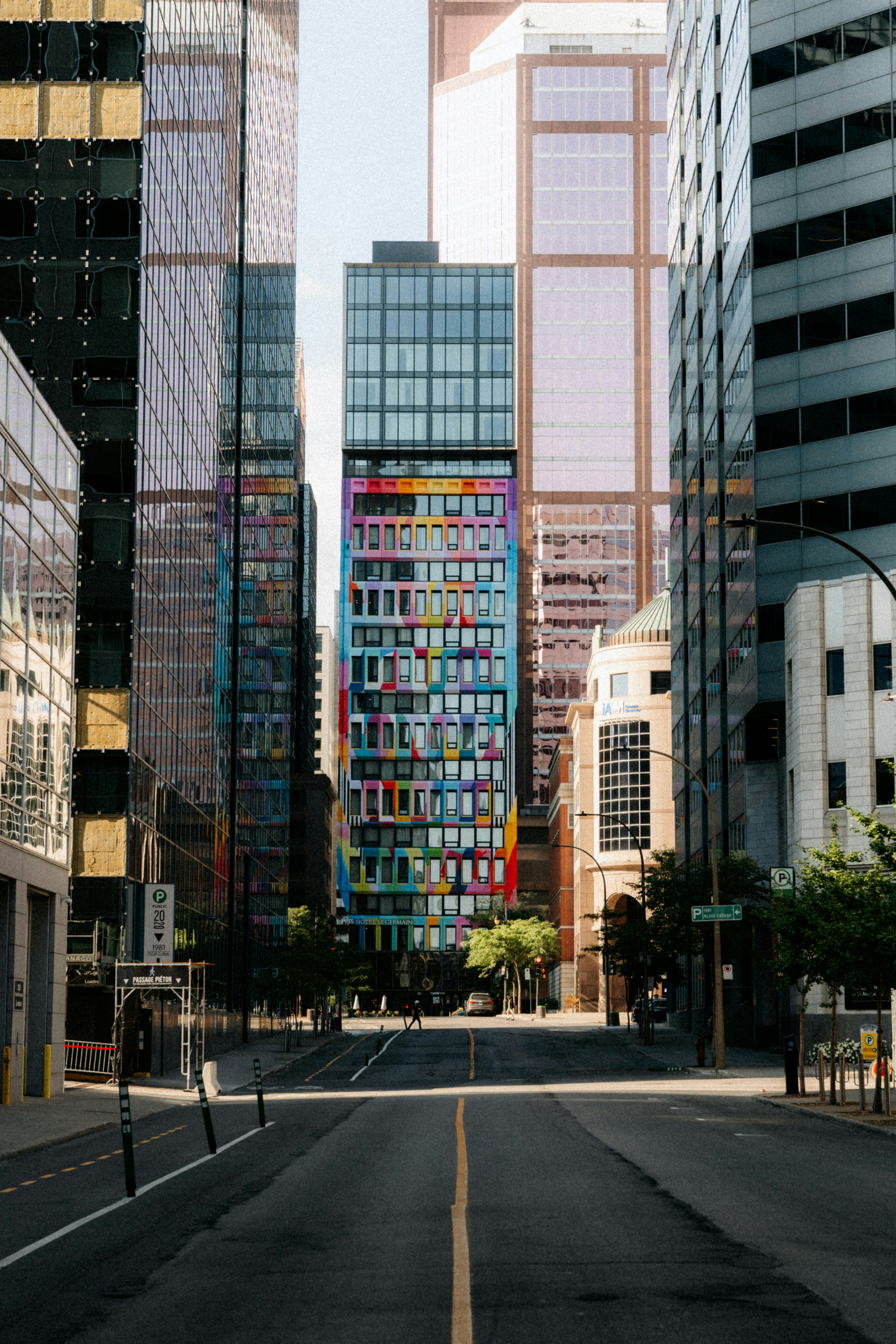 Urban Mosaic: A Colorful Contrast Amidst Glass Giants