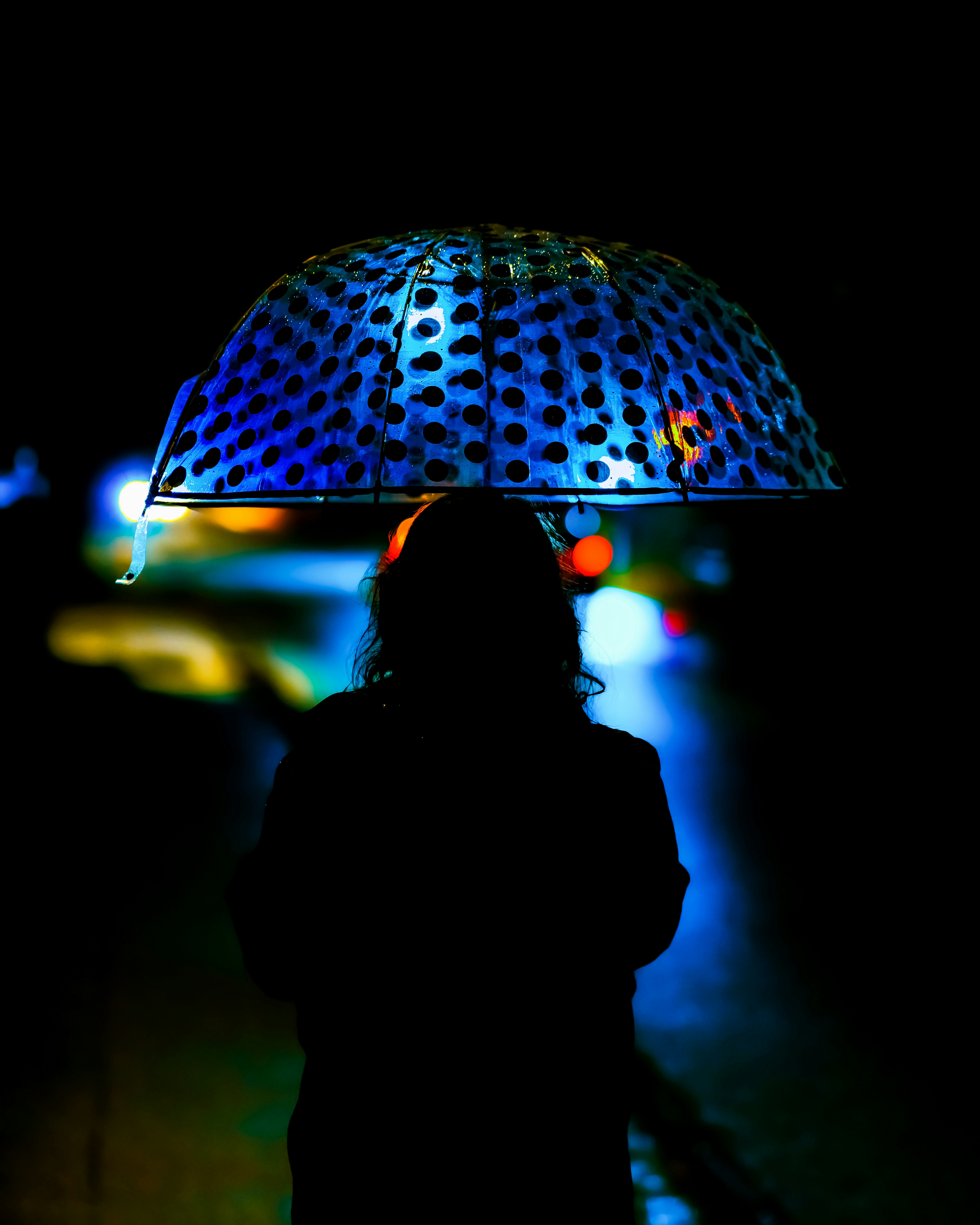Illuminated Solitude Under the Polka-Dotted Canopy