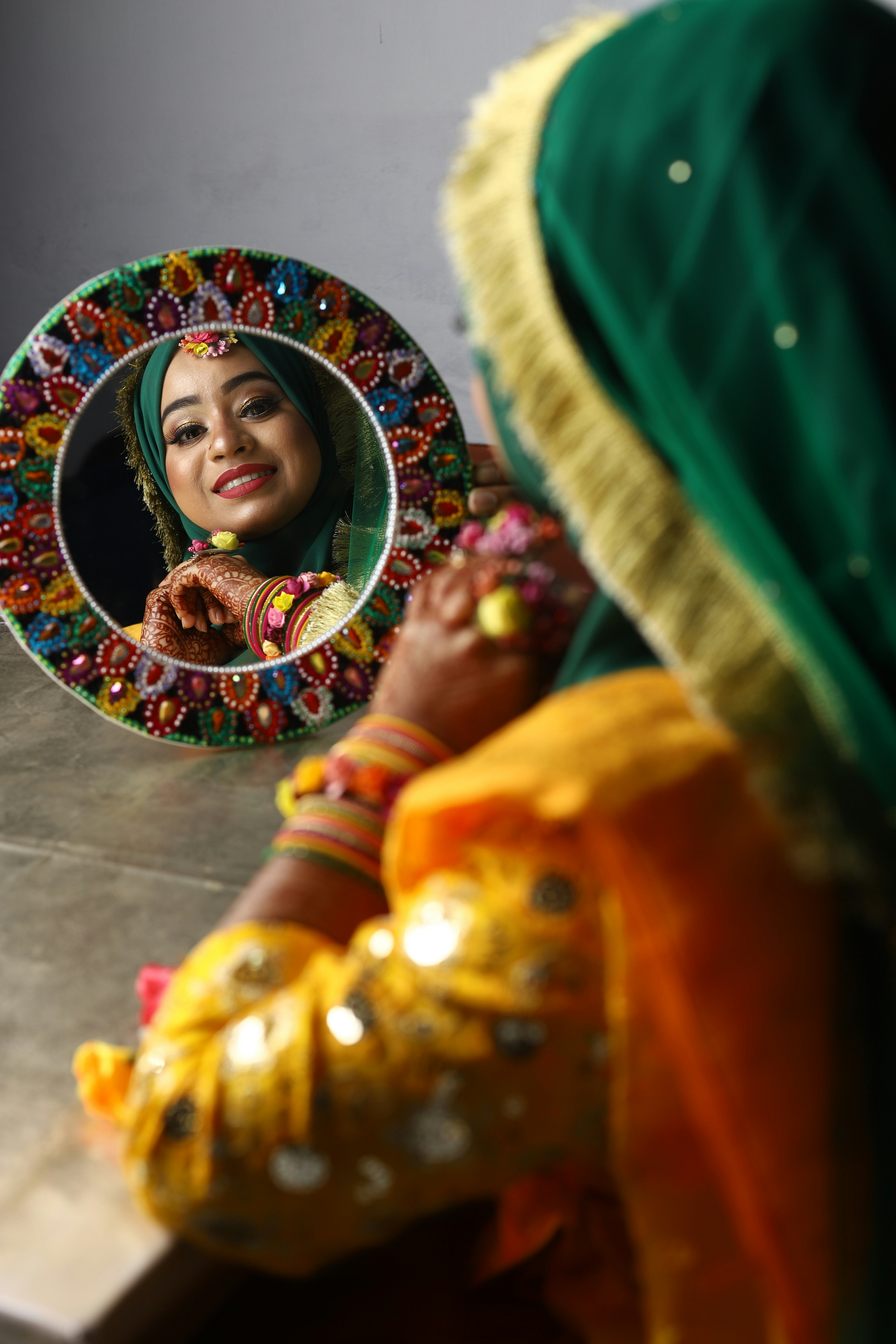 Reflection in a Colorful Mirror: Bride's Smile Treasured in Festive Attire