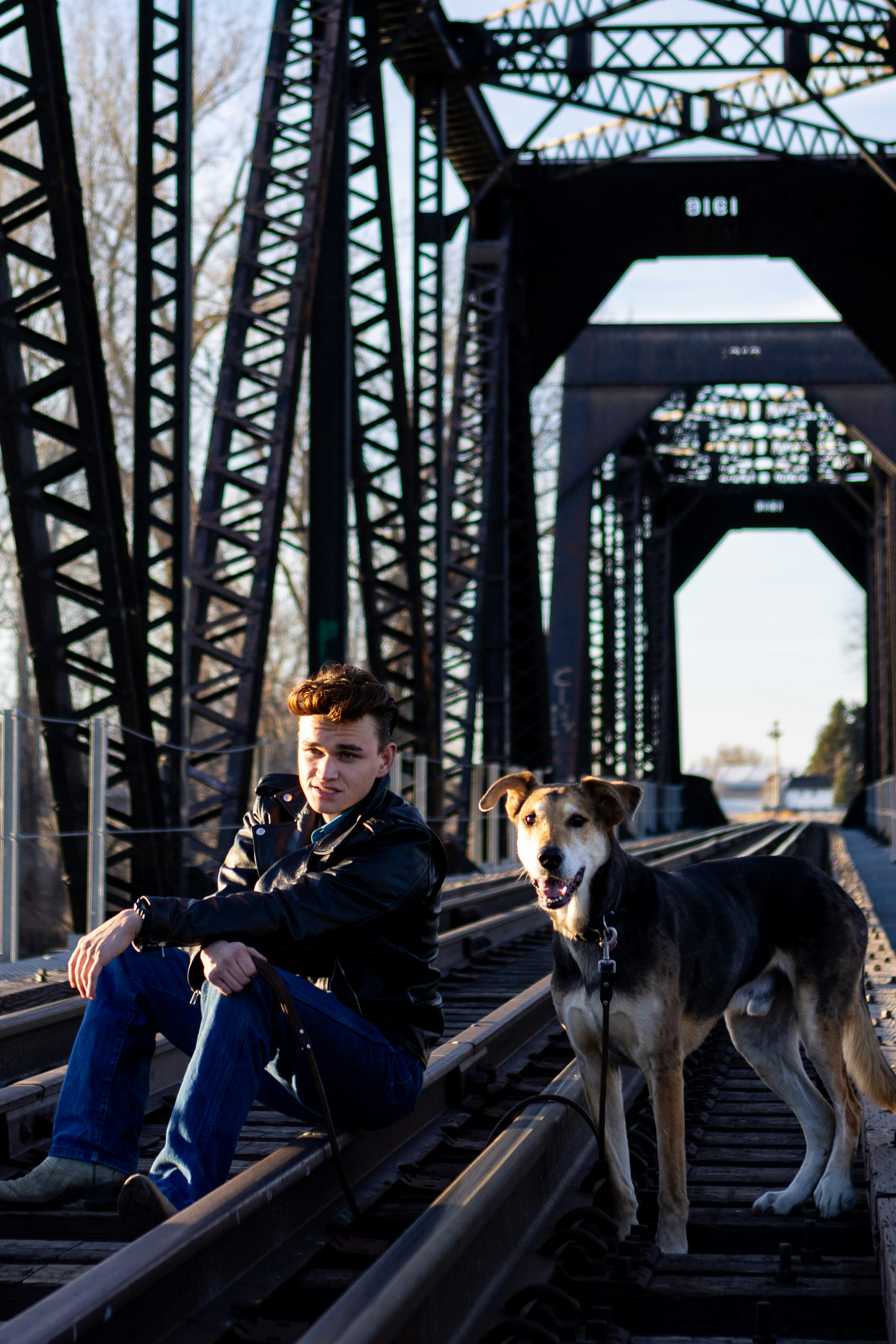 Pocatello model and actor Hondo Hendricks and Catahoula Leopard mix dog Apache hang out on the Collins Railroad bridge in Blackfoot Idaho on March 25, 2025.