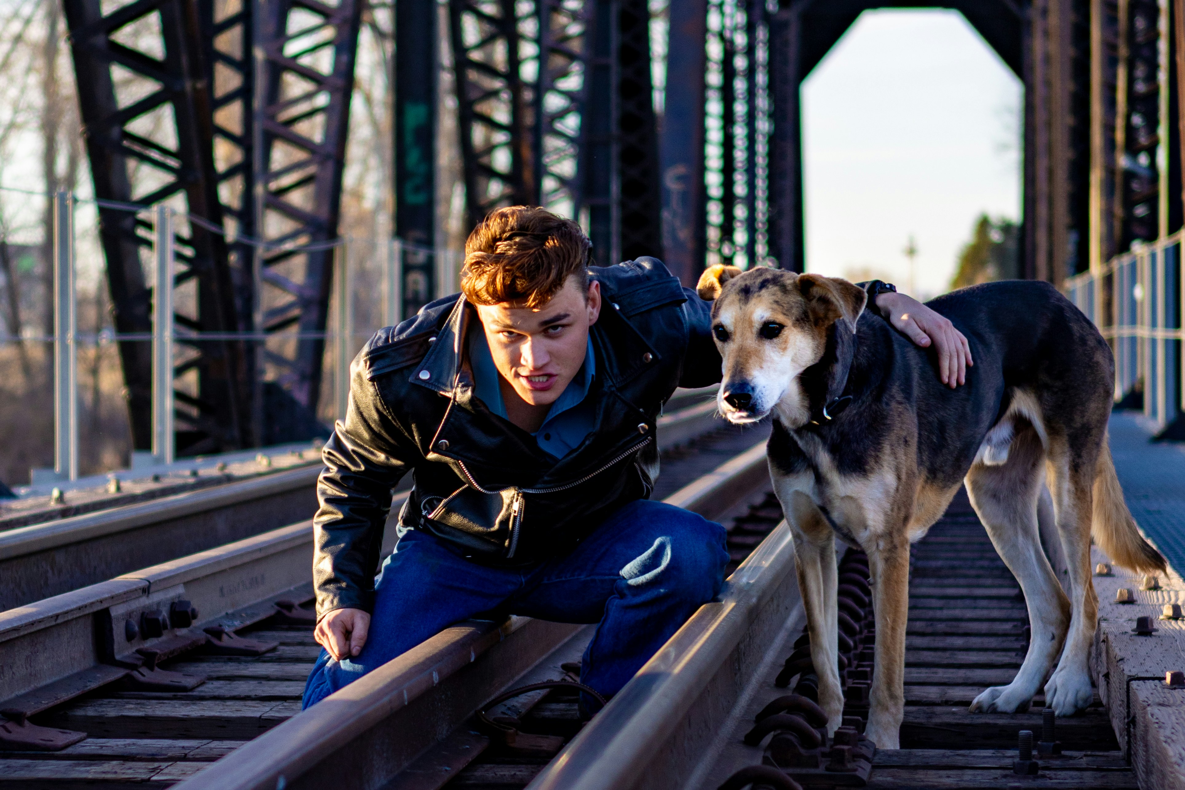 Pocatello model and actor Hondo Hendricks and Catahoula Leopard mix dog Apache hang out on the Collins Railroad bridge in Blackfoot Idaho on March 25, 2025.