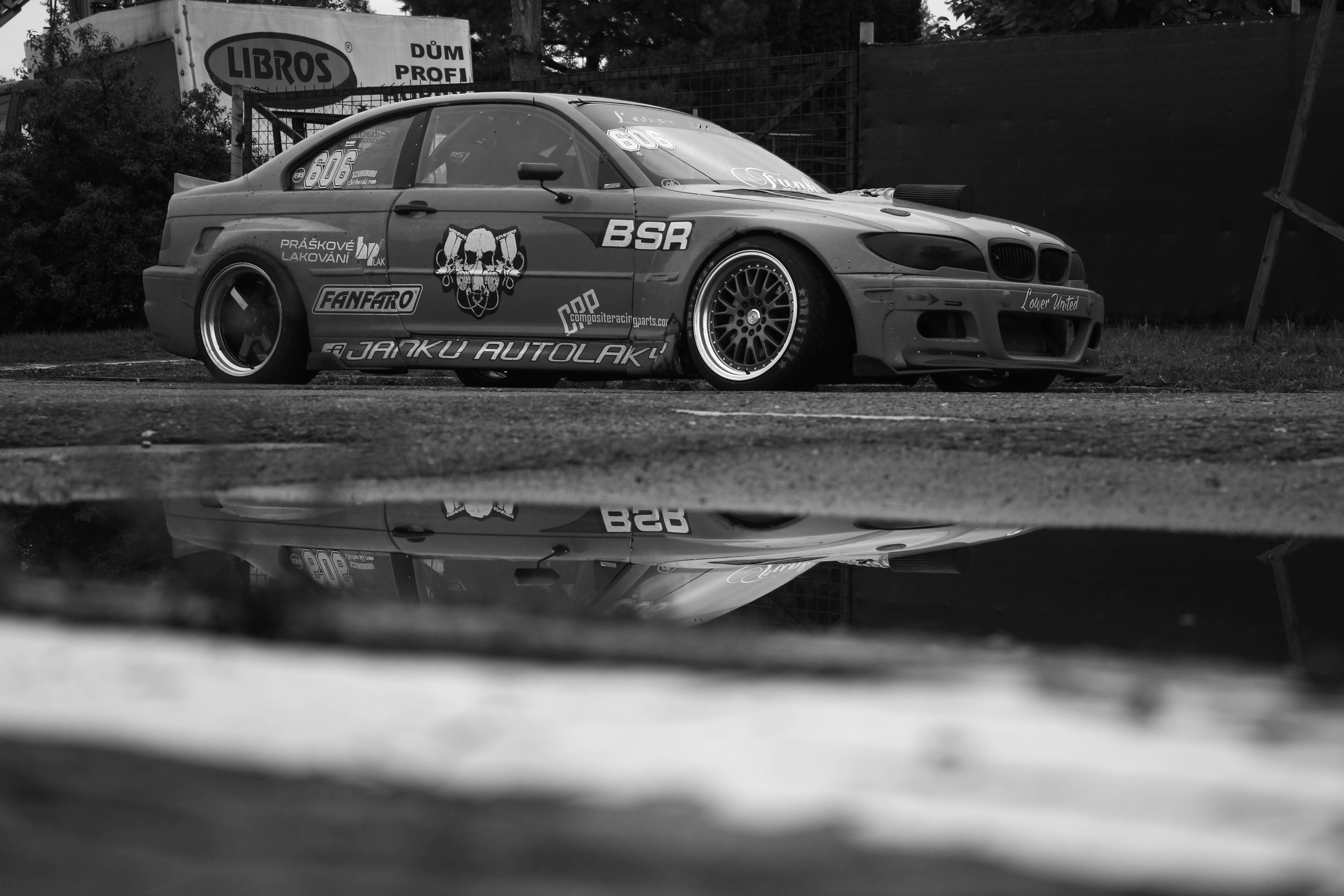 Little break from work? buymeacoffee.com/davidlembas | Modified sports car reflected in puddle after rain