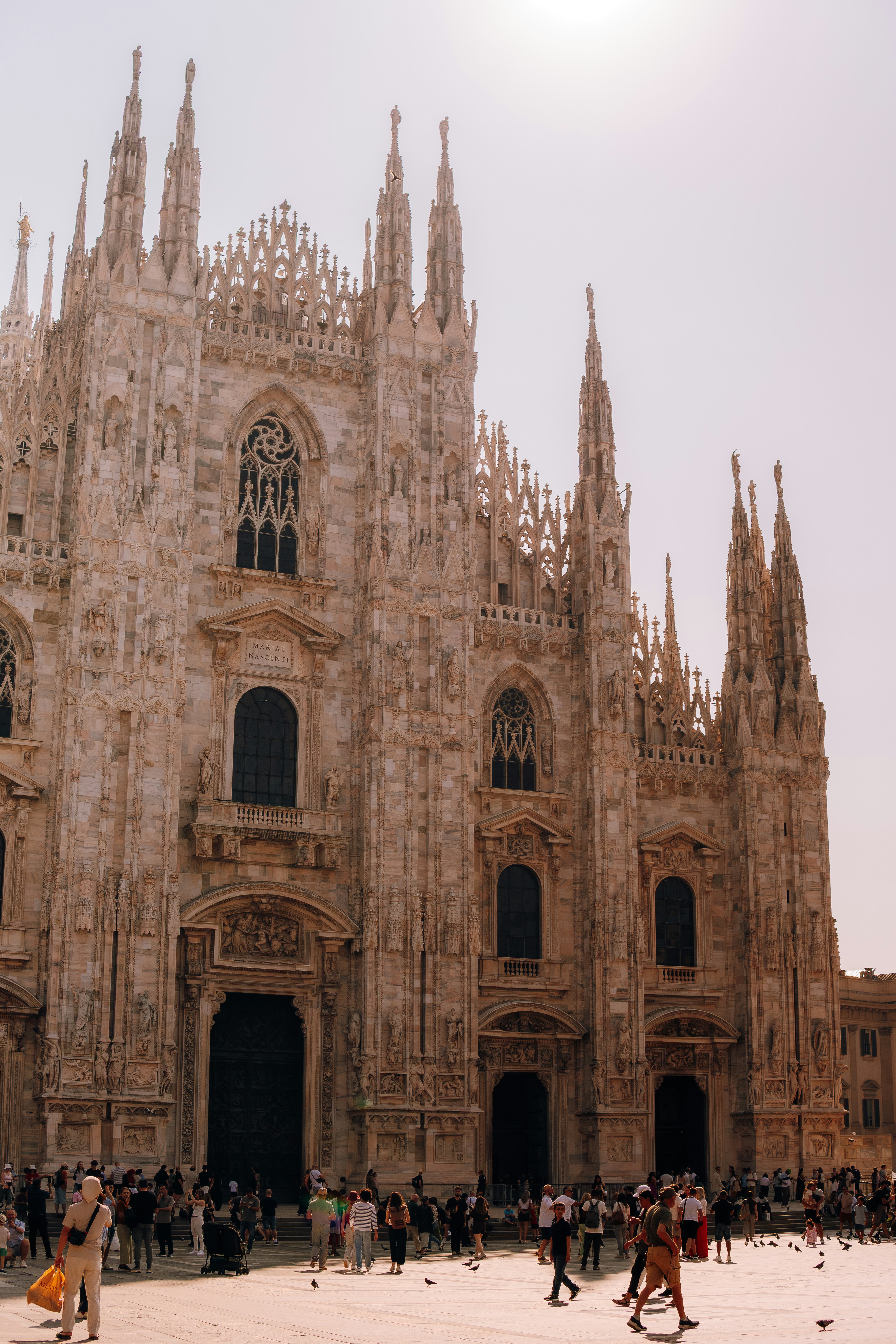 Gothic Cathedral Façade at Dusk with Crowd