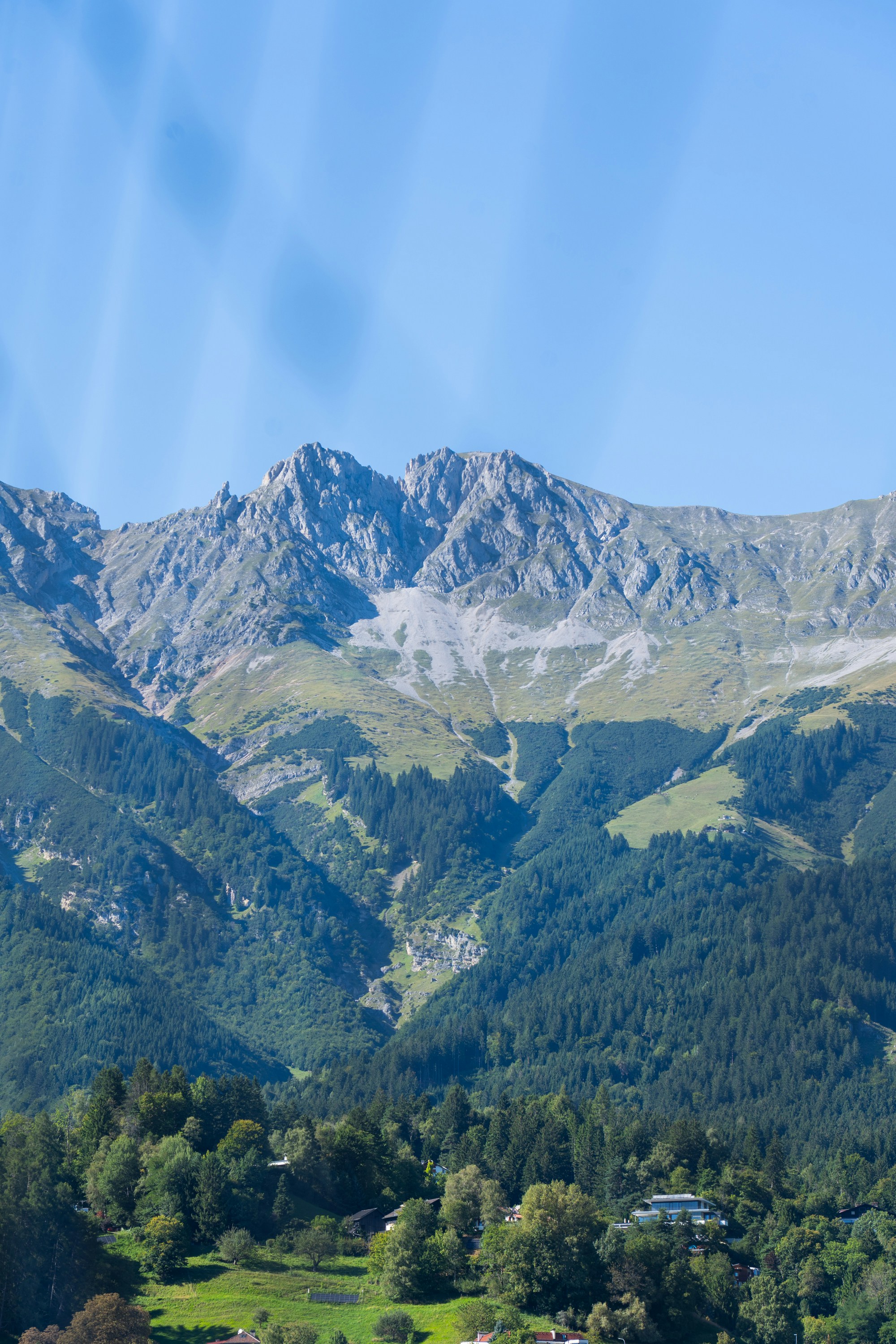 Majestic mountain range under a clear blue sky.