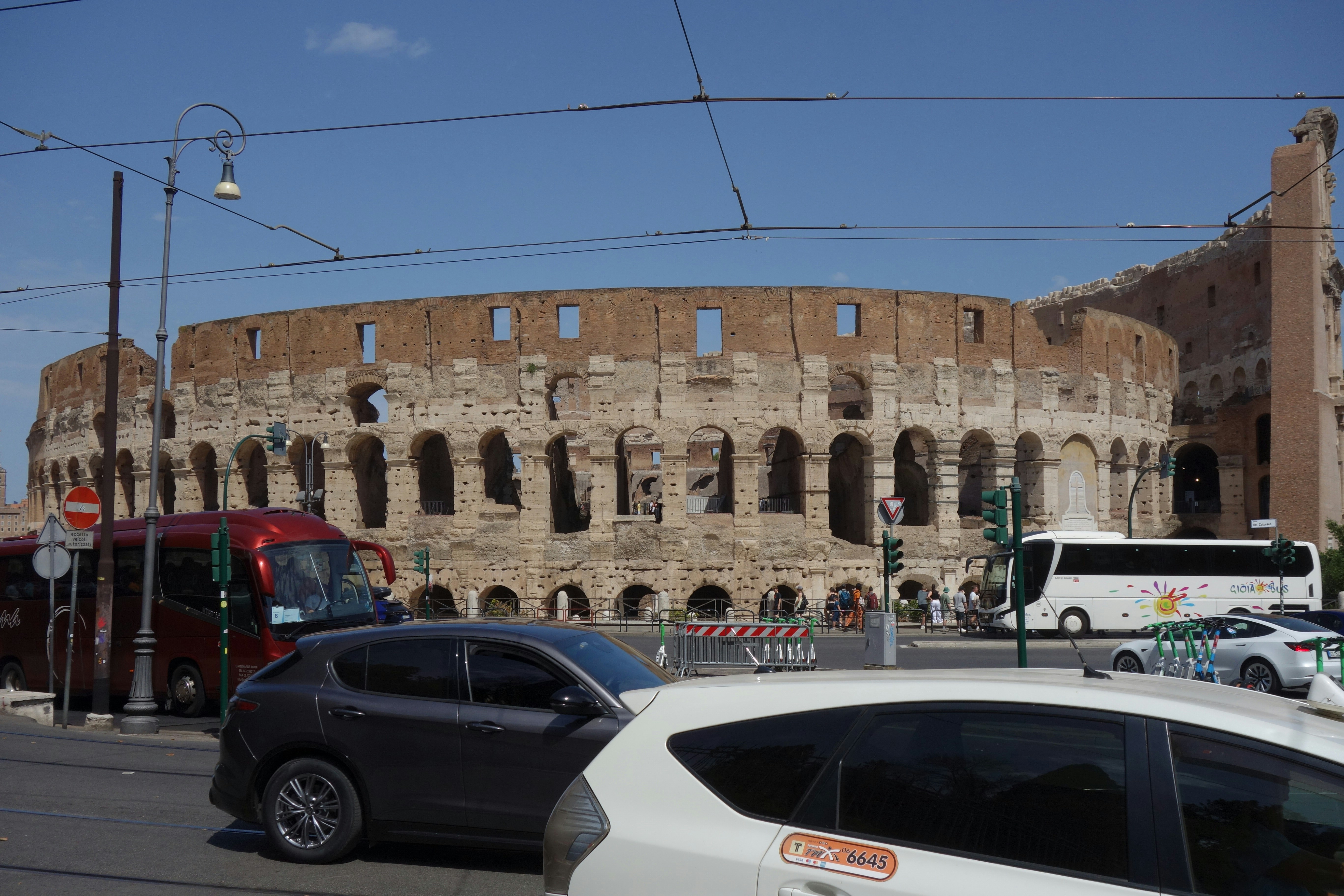 Stone Arches, Street Currents: Rome's Colosseum at Eye Level