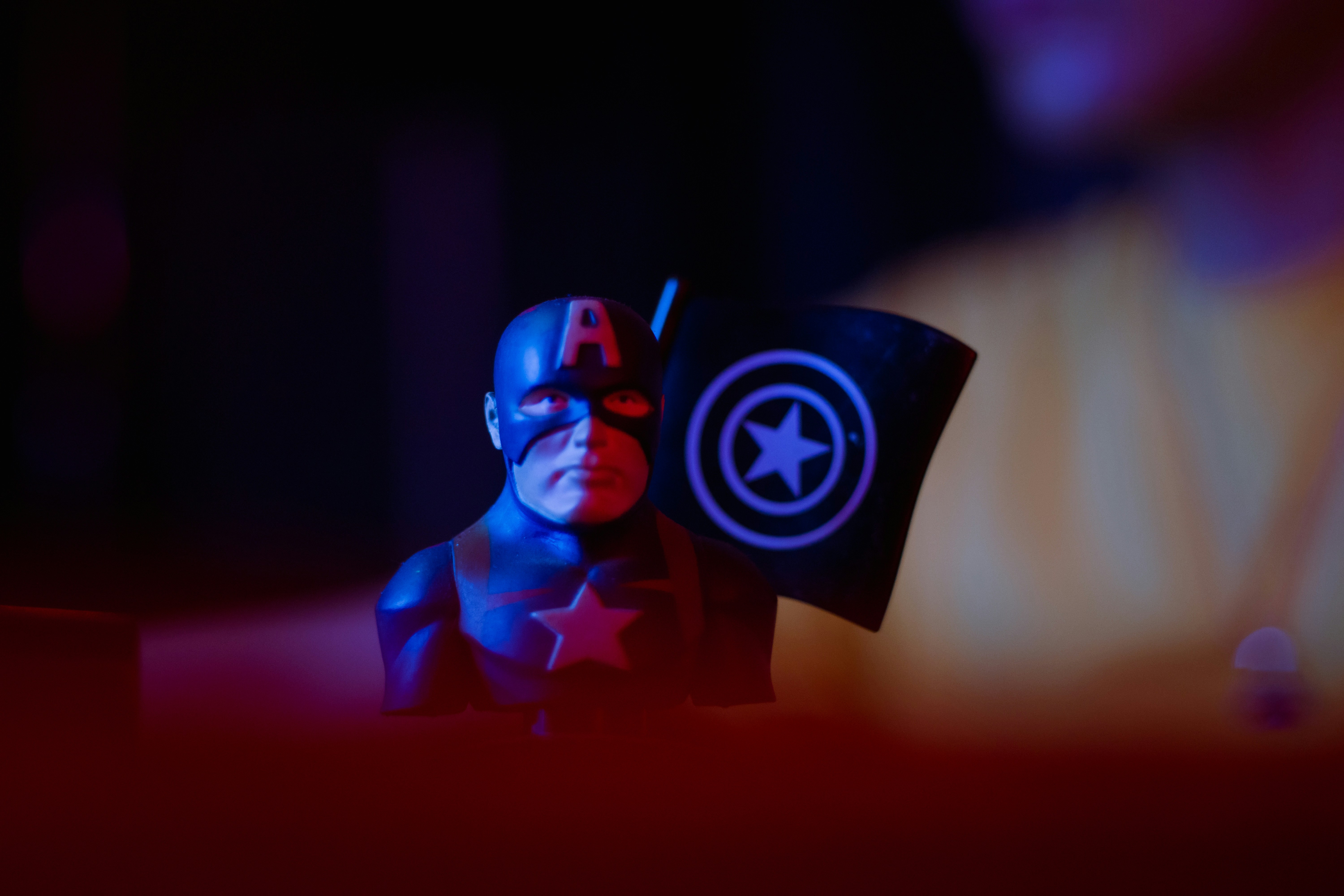 Captain america bust with shield in dramatic lighting